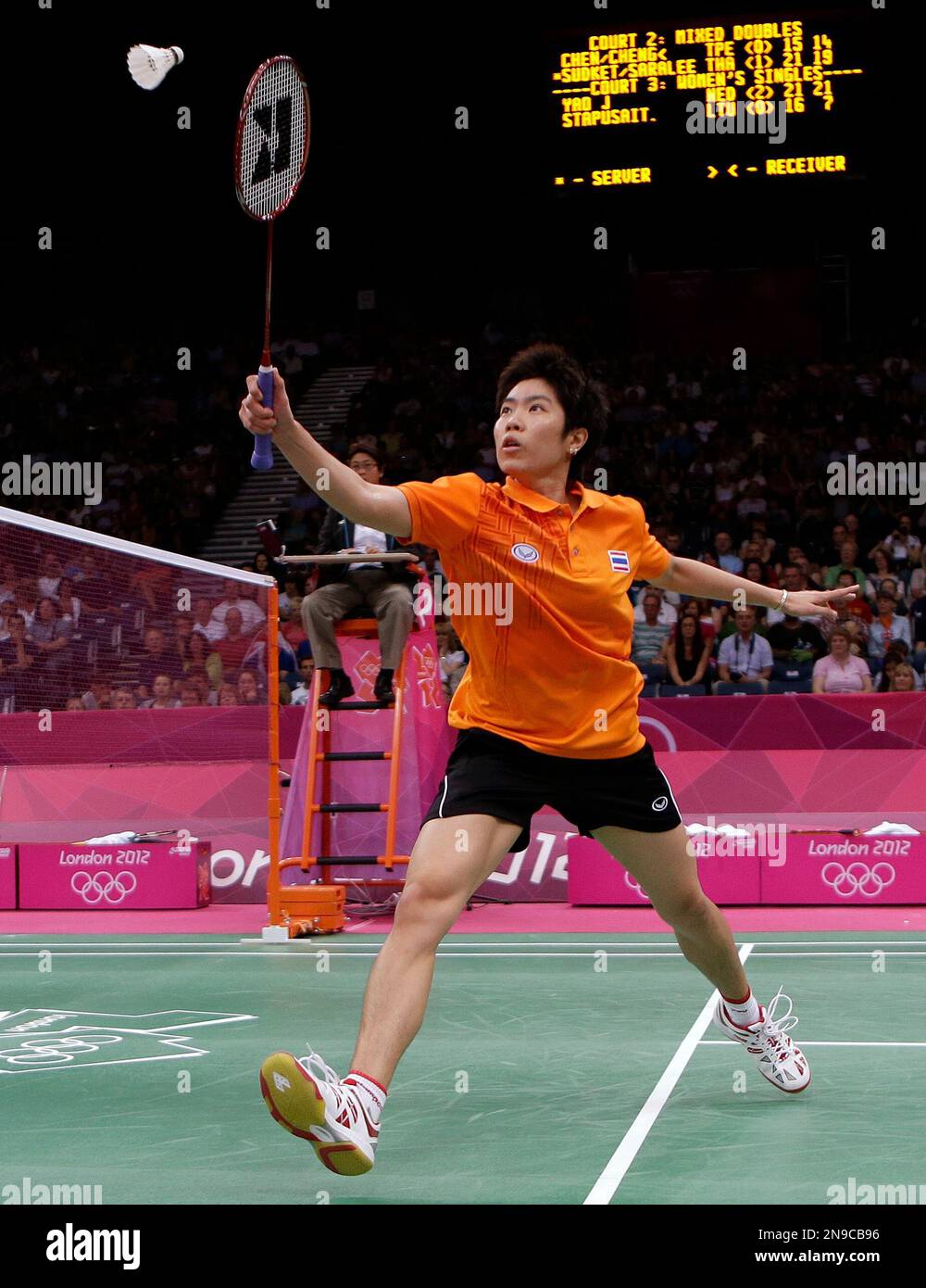 Thailand's Saralee Thoungthongkam returns the shuttlecock while playing with teammate Sudket ...