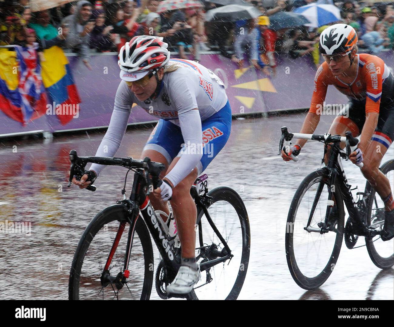 Russia's Olga Zabelinskaya leads Marianne Vos, of the Netherlands ...