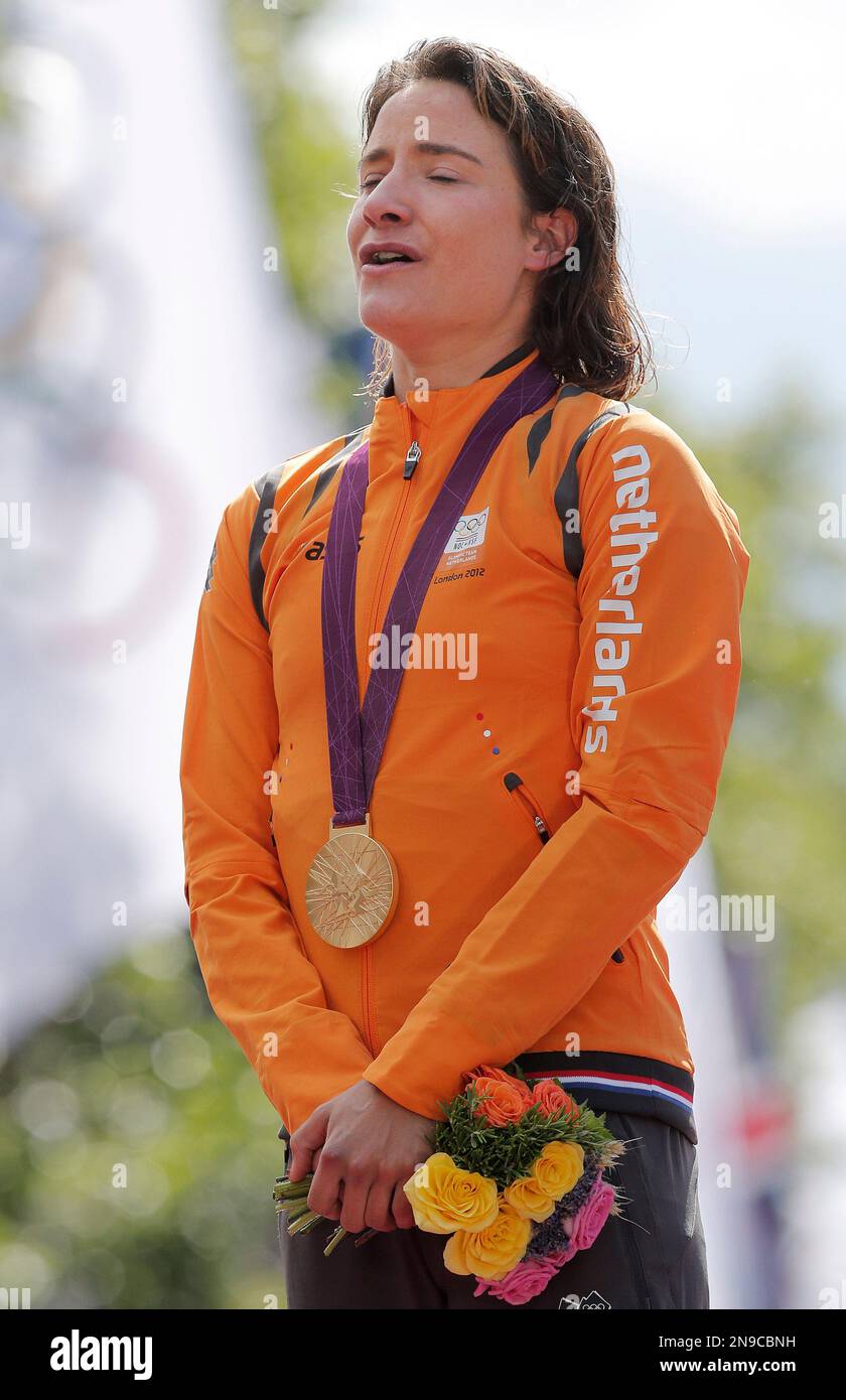 Marianne Vos, left, of The Netherlands, celebrates after winning the ...