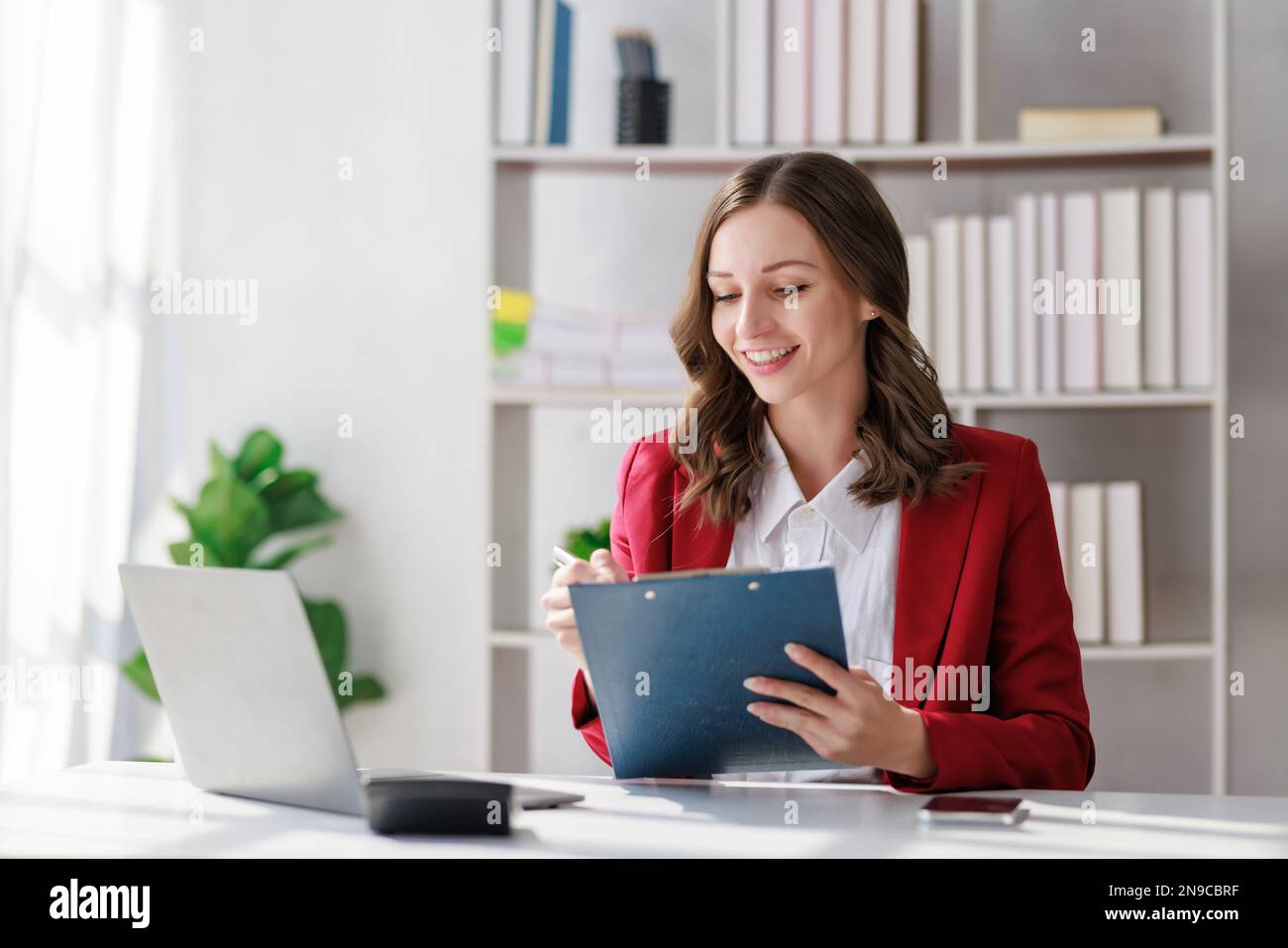 Concept of business working, Businesswoman wearing red suite sitting ...