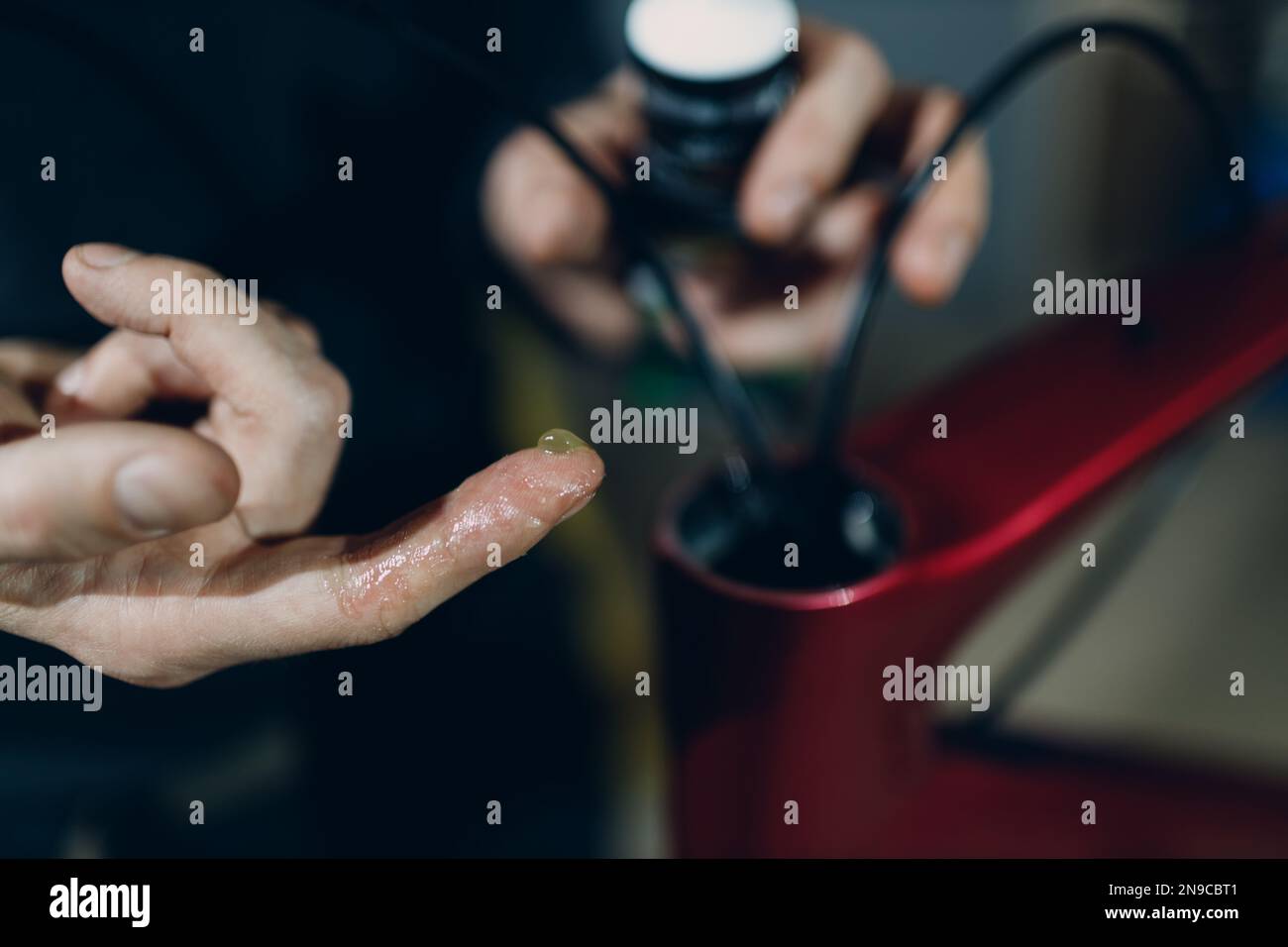 Male oiling bike hi-res stock photography and images - Alamy