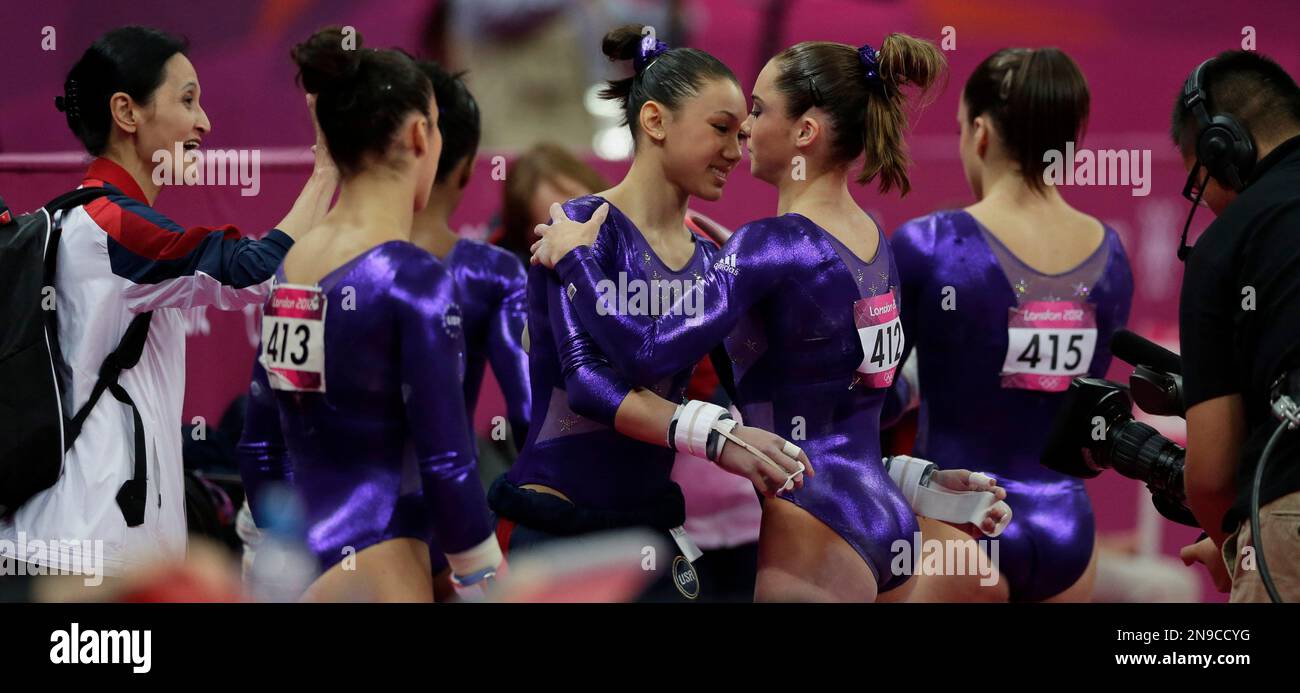 Us Gymnast Kyla Ross Center Is Hugged By Teammate Mckayla Maroney As Coach Jenny Zhang