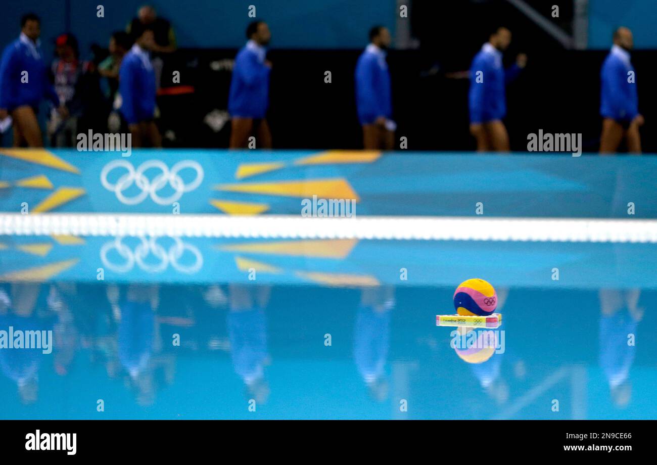 Greece water polo athletes are reflected in the pool before the start ...