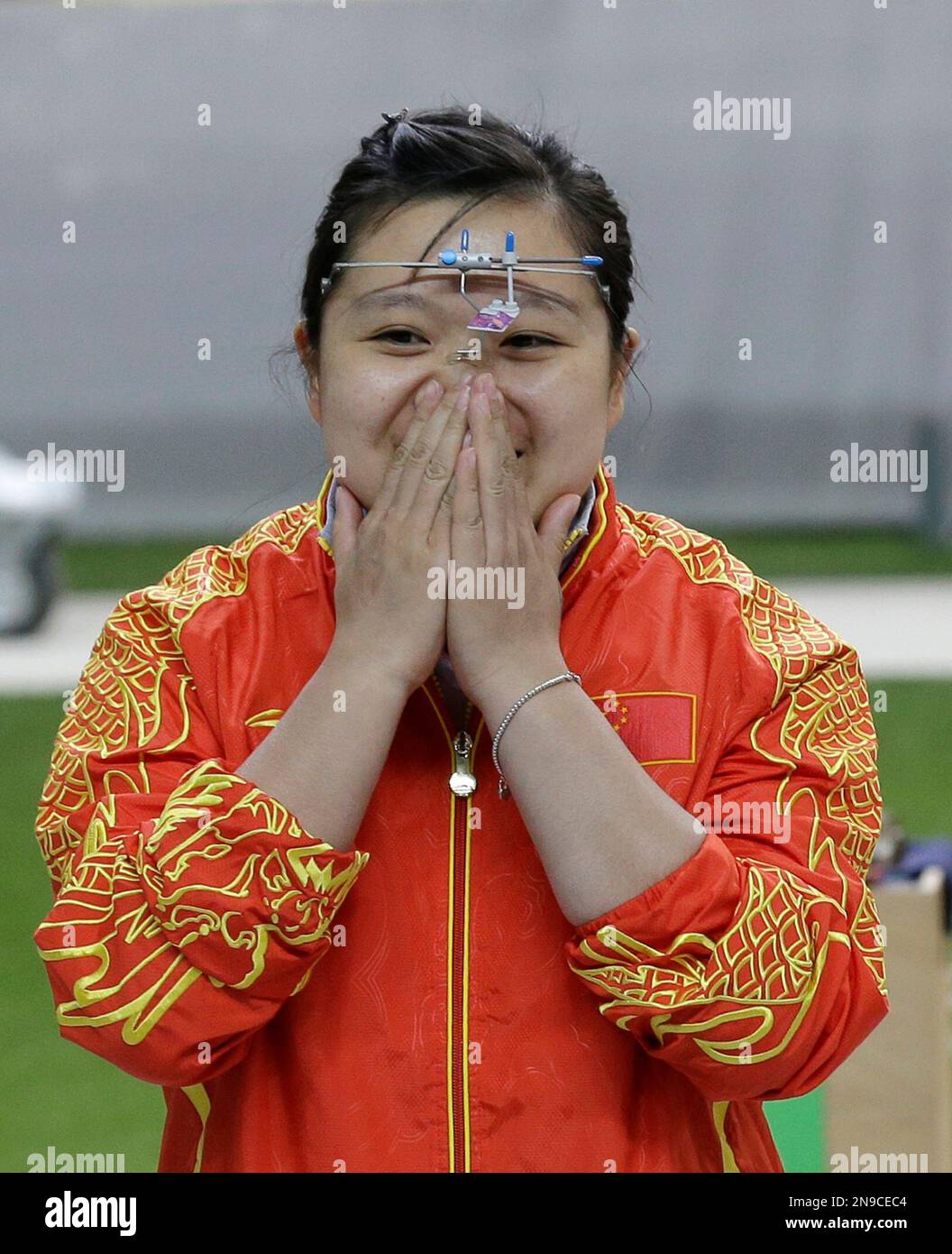 China's Guo Wenjun reacts after realizing she has won gold following ...
