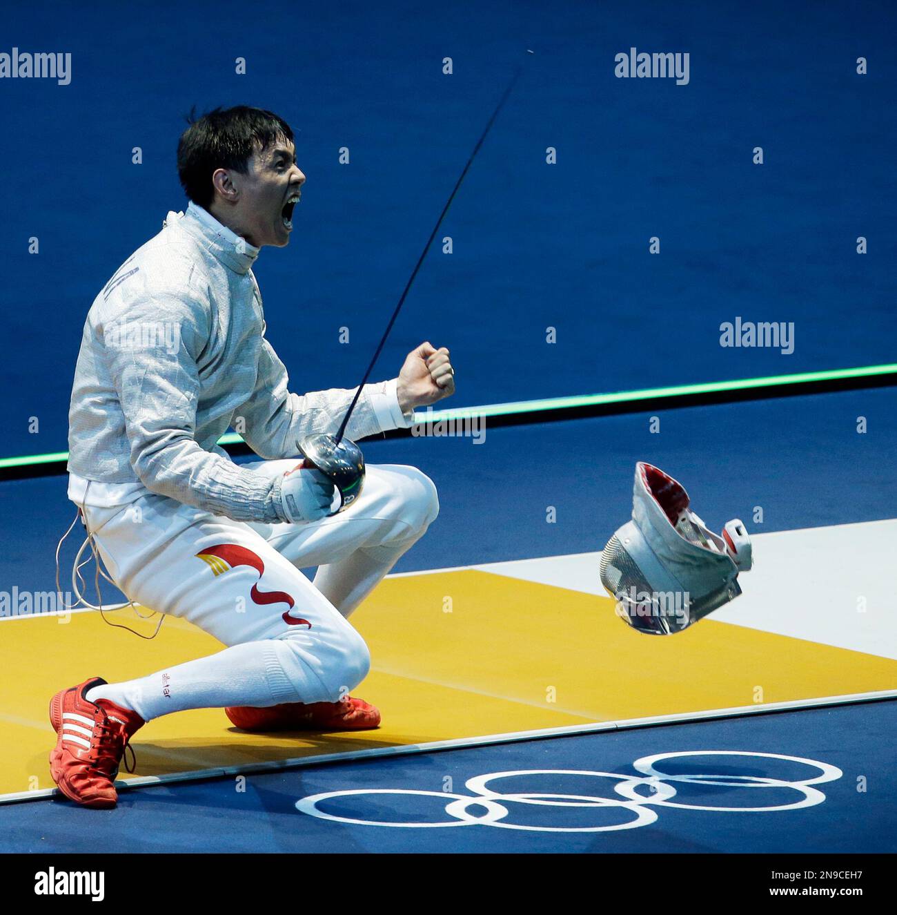 China's Man Zhong reacts after defeating South Korea's Junghwan Kim ...