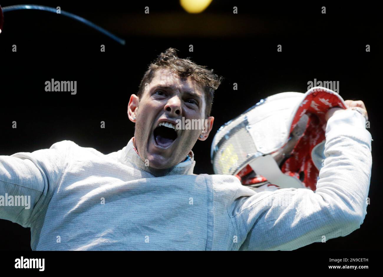 Italy's Aldo Montano reacts after defeating Belarus' Valery Pryiemka ...