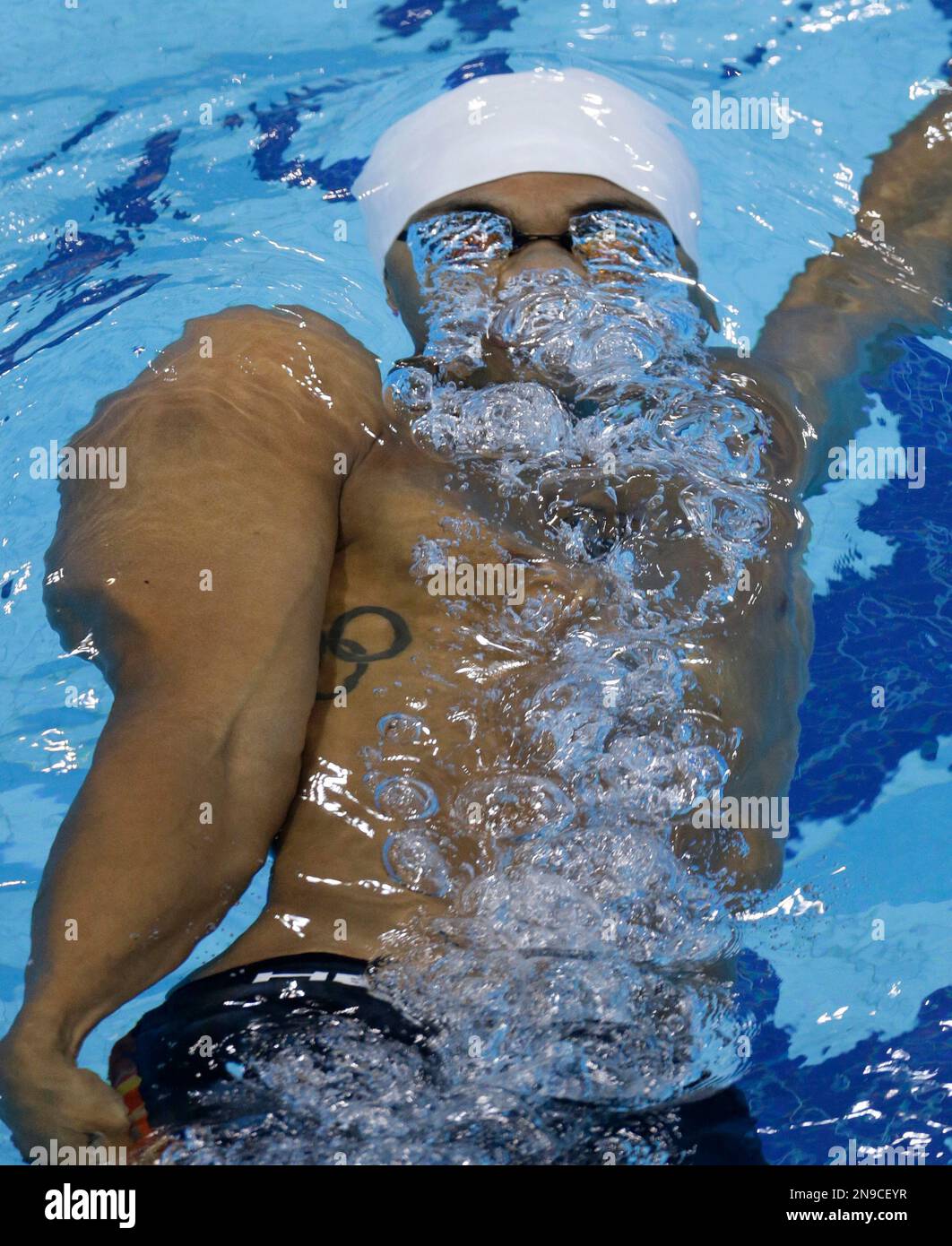 Barbados' Ally Bradley competes in the men's 100-meter backstroke at ...