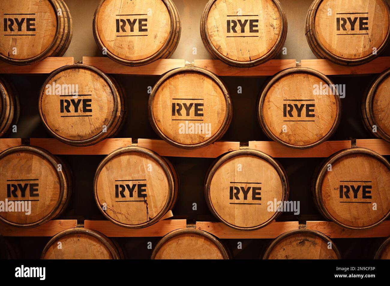 Some whiskey made from rye aging in barrels Stock Photo - Alamy