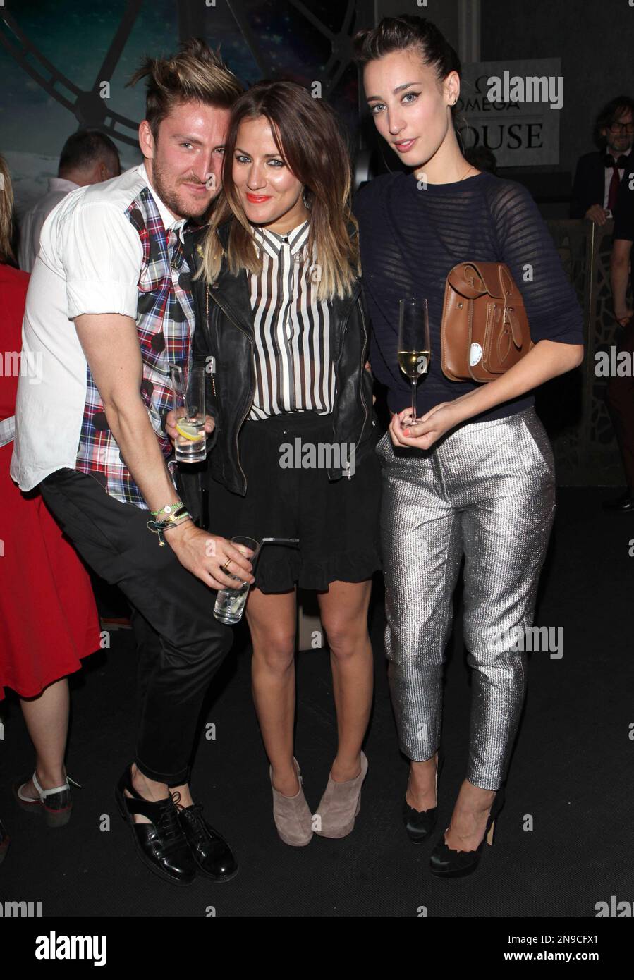 Henry Holland, Caroline Flack and Laura Jackson are seen at the opening ...