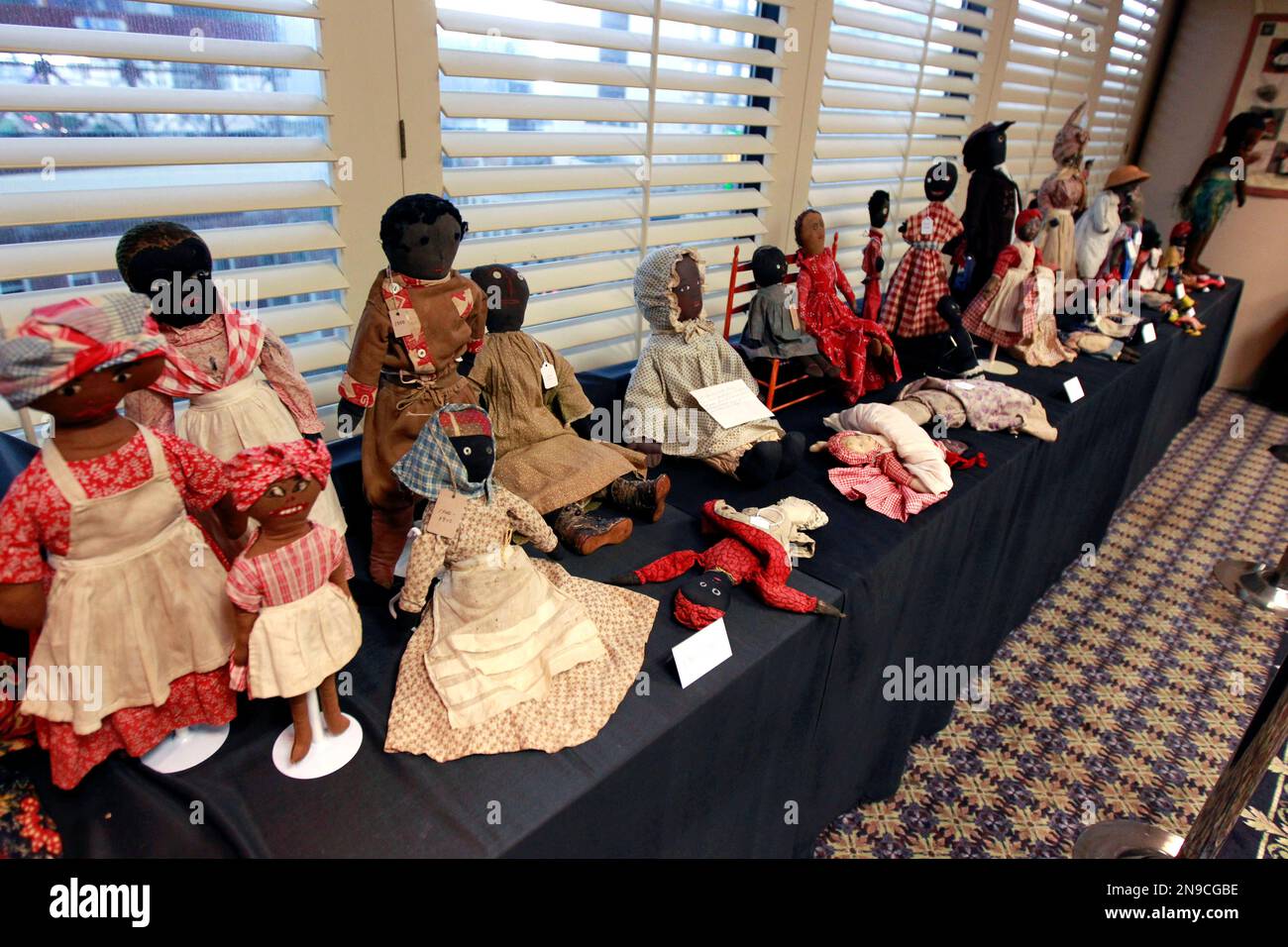 In this Wednesday, July 25, 2012 photo, historic black cloth dolls ...