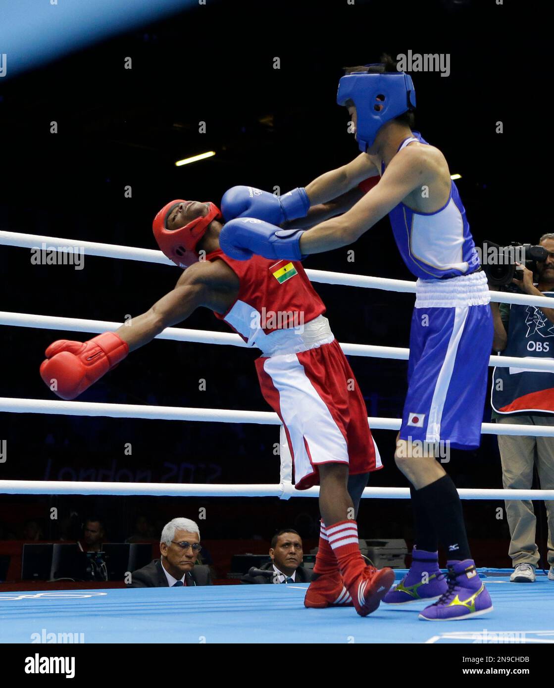 Ghana's Isaac Dogboe fights Japan's Satoshi Shimizu, right, during a ...