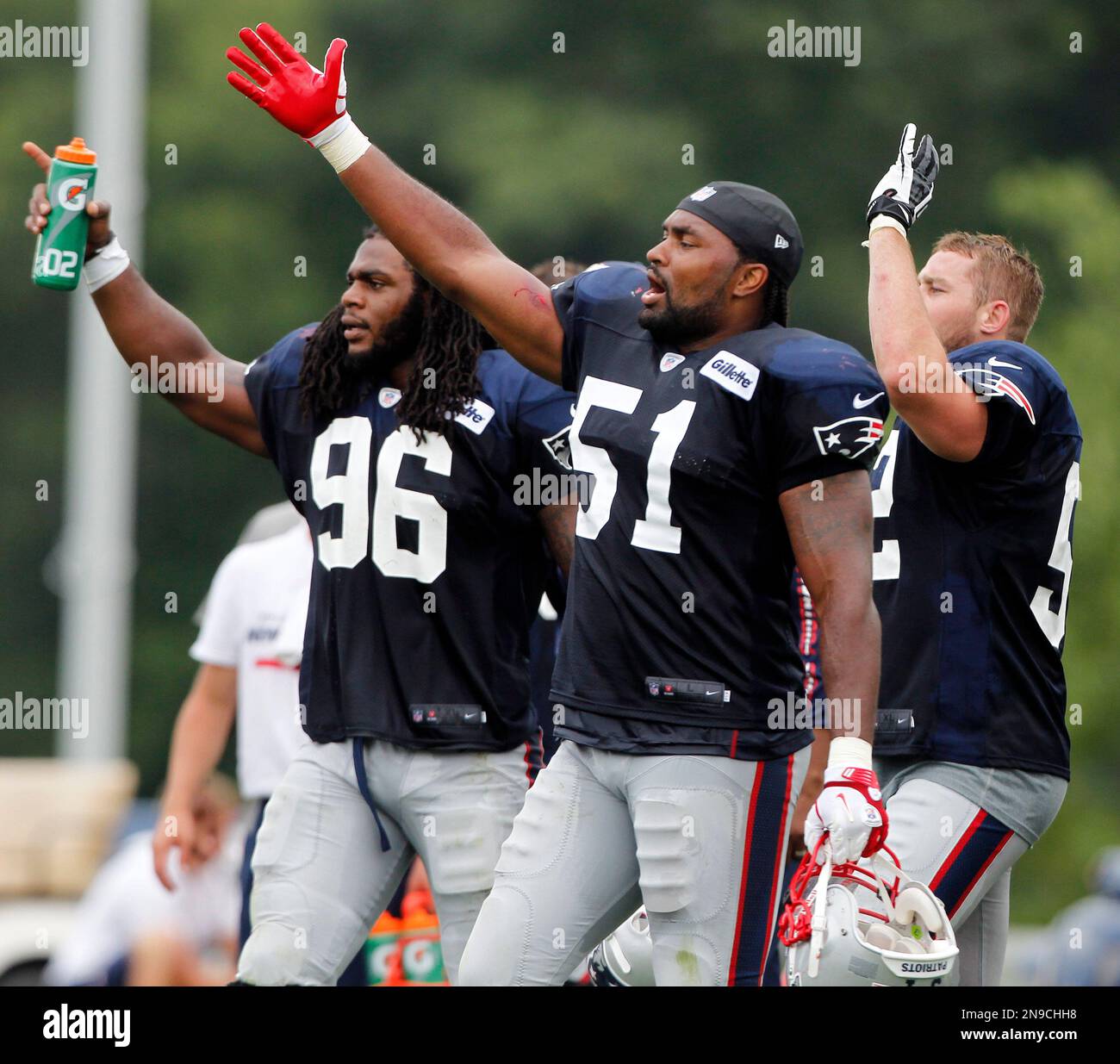 New England Patriots' Jerod Mayo (51), Jermaine Cunningham (96) and ...