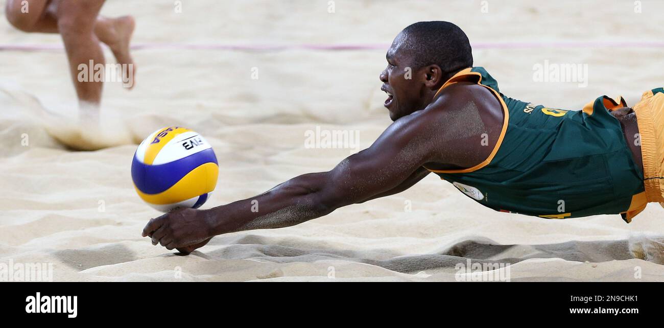 Freedom Chiya from Southa Africa dives for a ball during the Beach ...