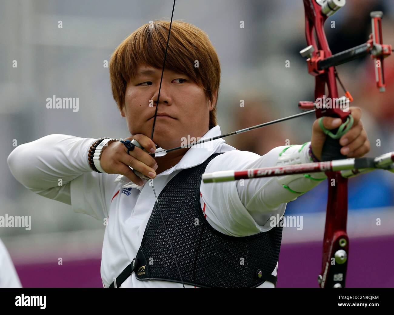 South Korea's Kim Bub-min shoots for a bronze medal in the team archery ...