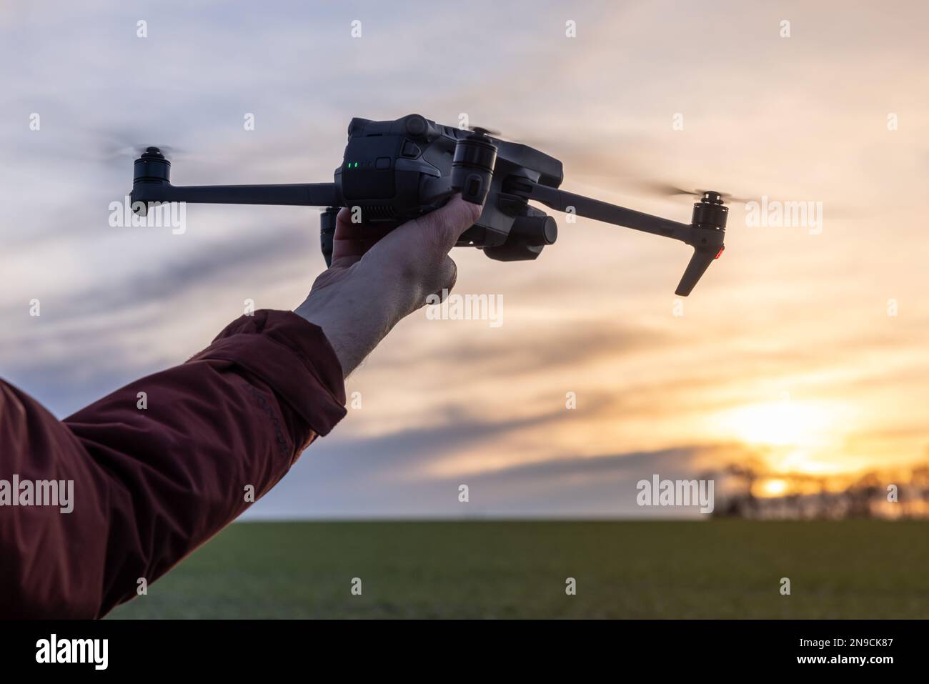 Drone Flying from the Hand of a Drone Pilot Stock Photo - Alamy