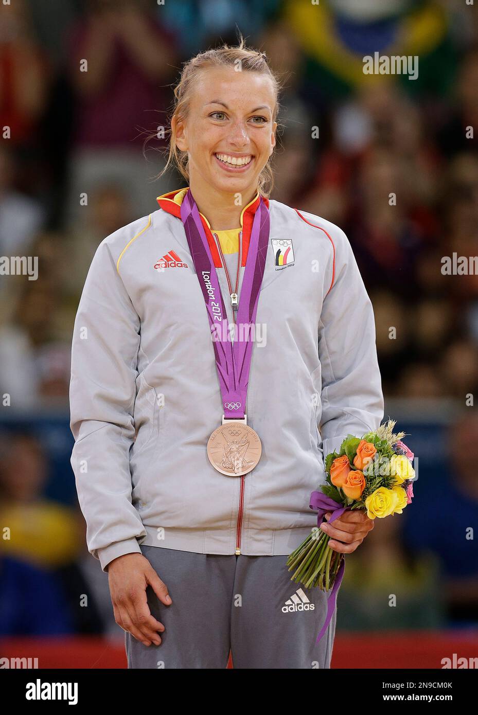 Charline van Snick, of Belgium, smiles after receiving the bronze medal ...