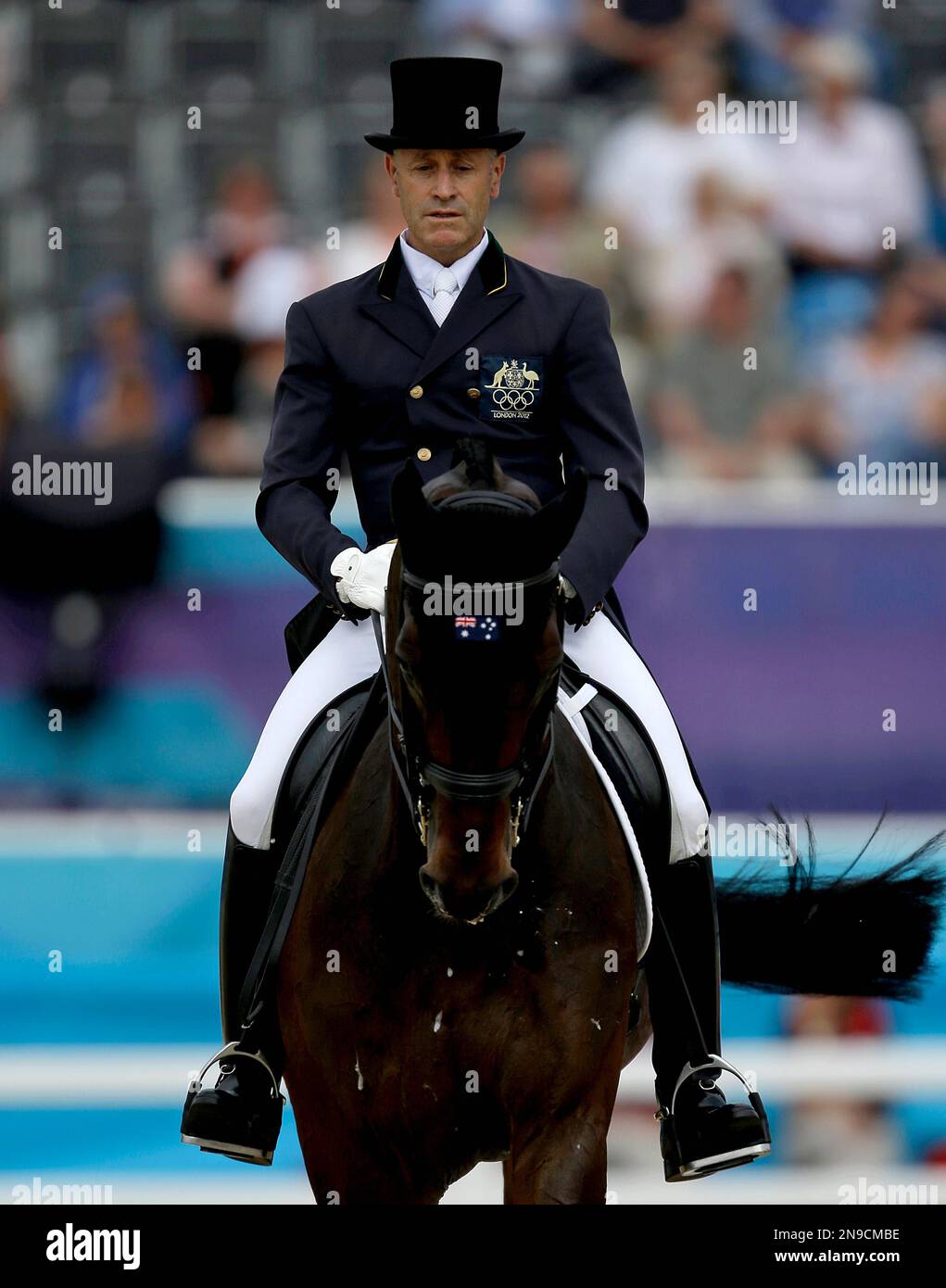 Andrew Hoy, of Australia, rides his horse Rutherglen, in the equestrian ...