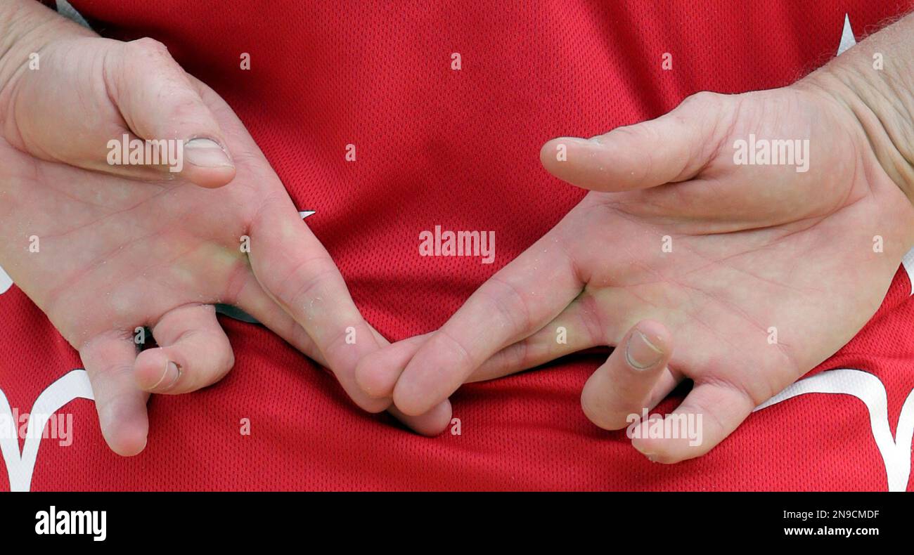 Canada's Josh Binstock signals his teammate prior to a serve against ...