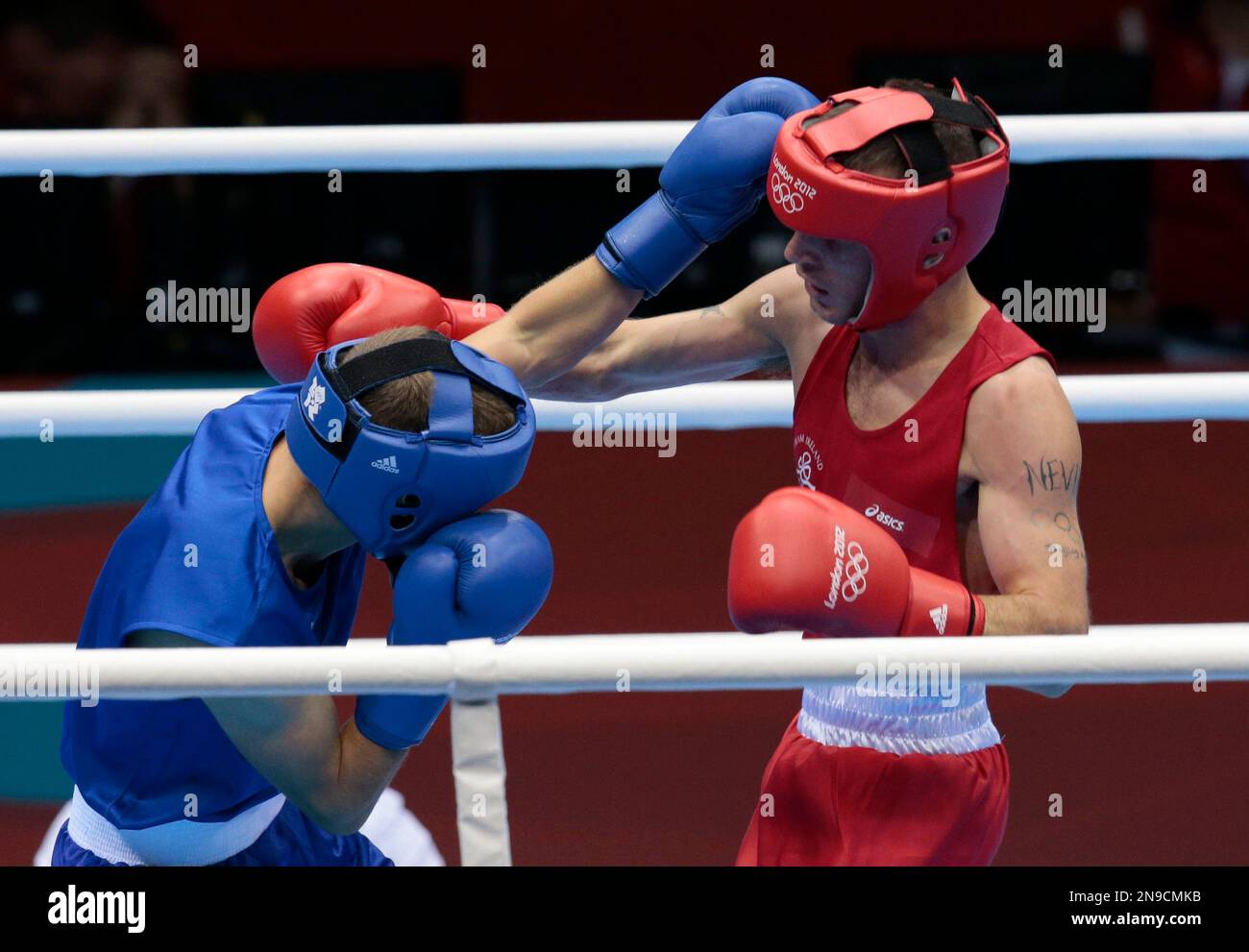 Ireland's John Joe Nevin fights Denmark's Dennis Ceylan, left, during a ...