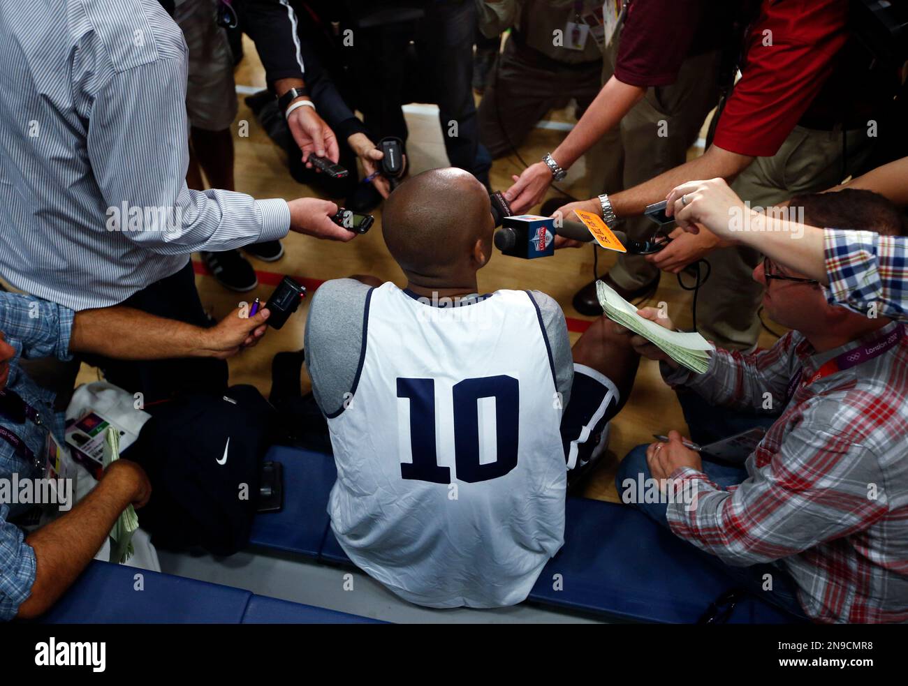 United States guard Kobe Bryant (10) talks to reporters during a men's ...