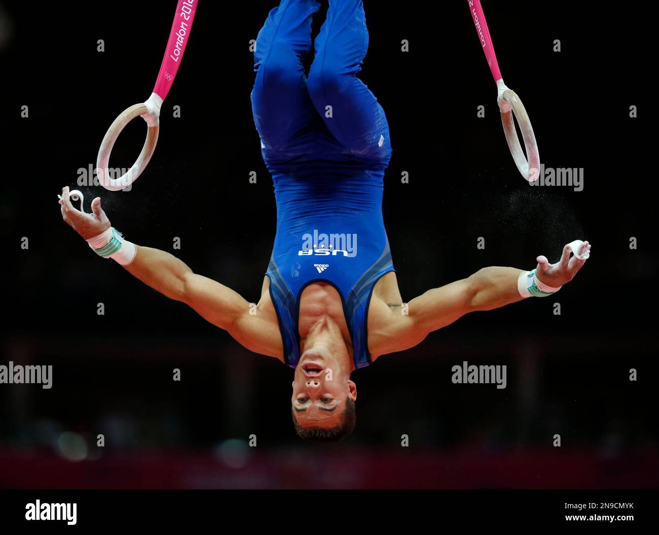 U.S. gymnast Jacob Dalton jumps off the rings during the Artistic ...
