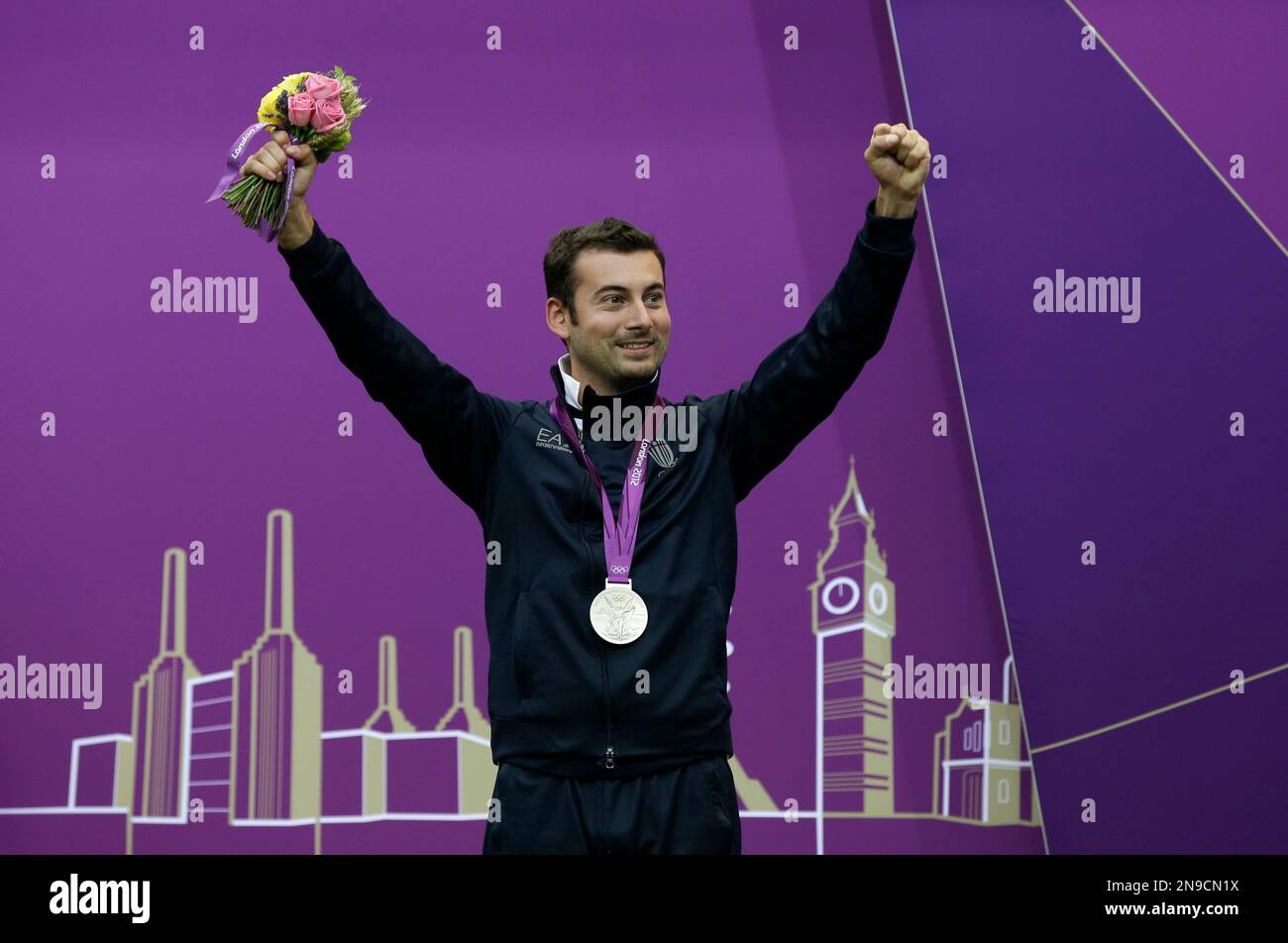 Italy's Luca Tesconi celebrates after winning the silver medal in the ...