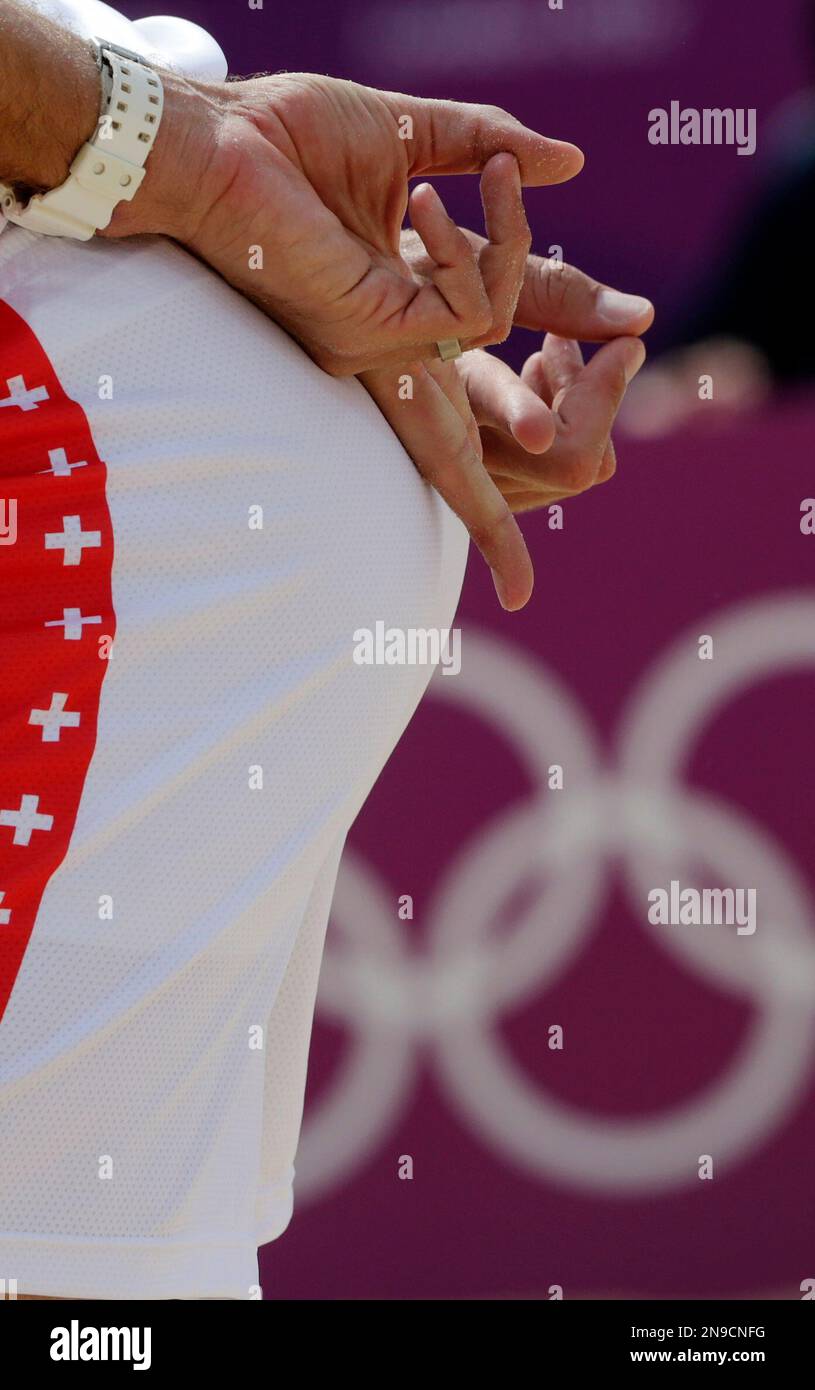 Switzerland's Sebastian Chevallier signals his teammate during a match ...