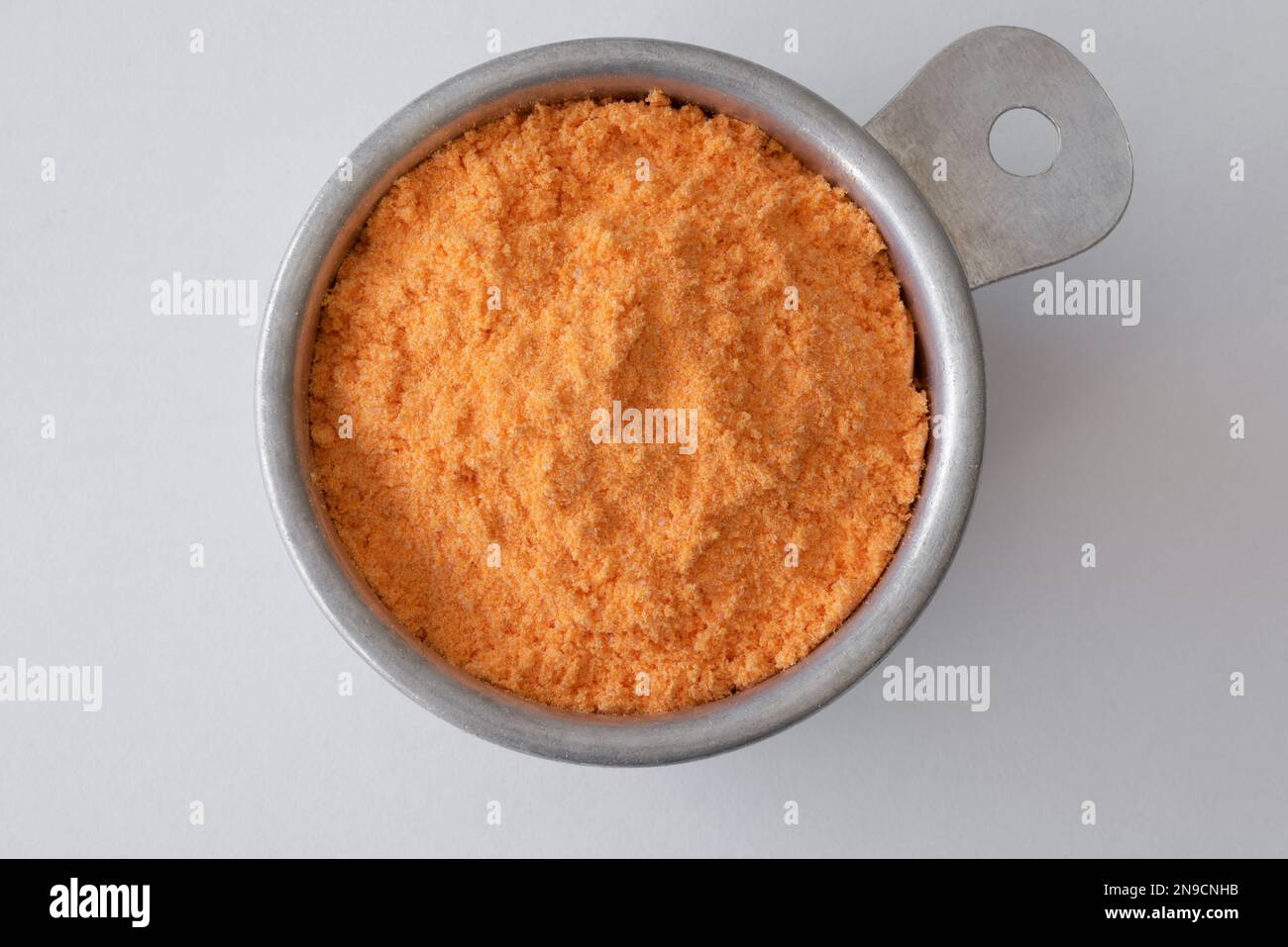 Cheese Powder in a vintage Measuring Cup Stock Photo - Alamy