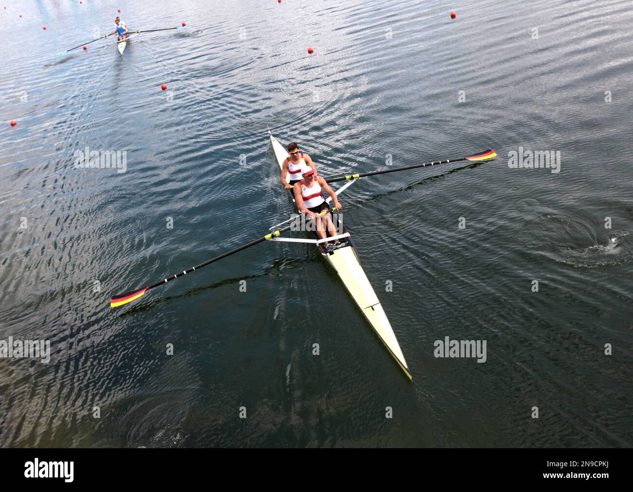 The German boat heads to the start of the men's rowing pair heat in ...