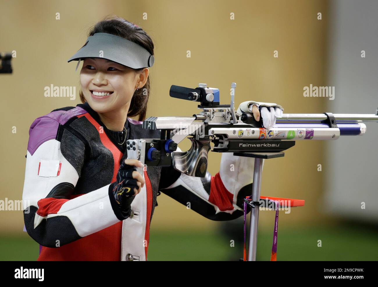 China's Yi Siling reacts after winning the gold medal in the women's 10-meter air rifle event at ...