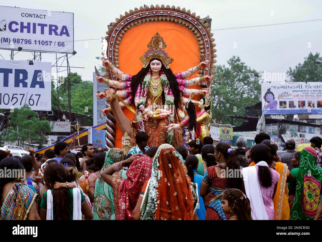 Indian devotees gather around an idol of Hindu Goddess Dashama during a ...