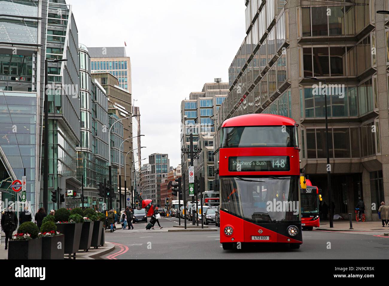 Red bus in the downtown of London Stock Photo - Alamy