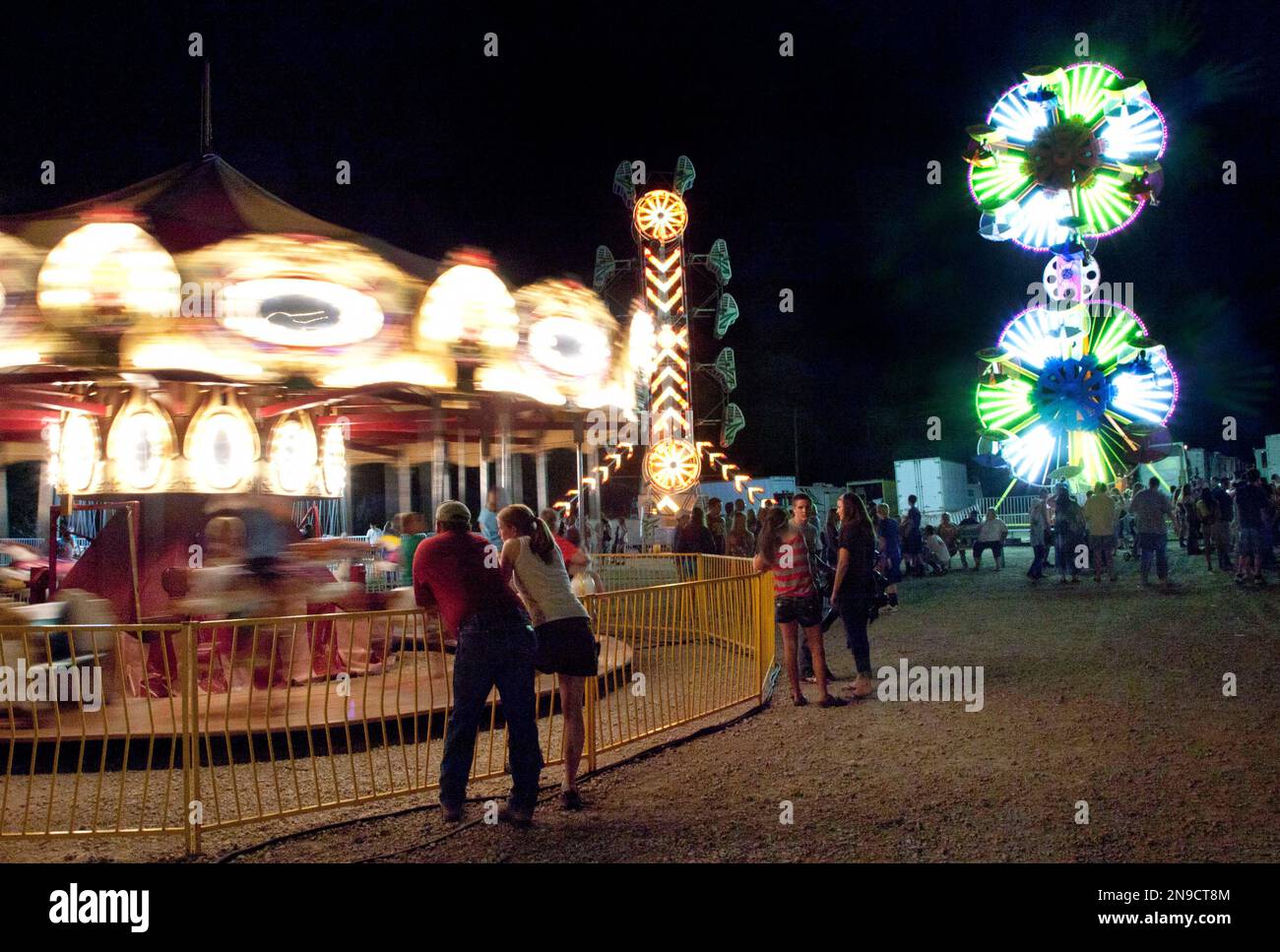 Carnival rides spin at the Eudora City Picnic in Eudora, Kan., Friday ...