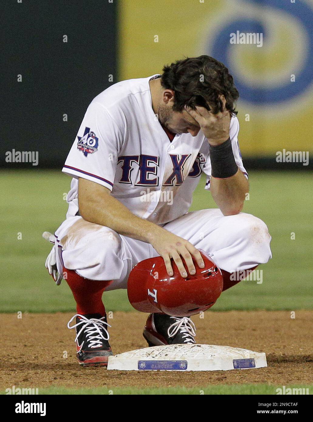 Texas Rangers' Ian Kinsler looks down while on second base during a ...