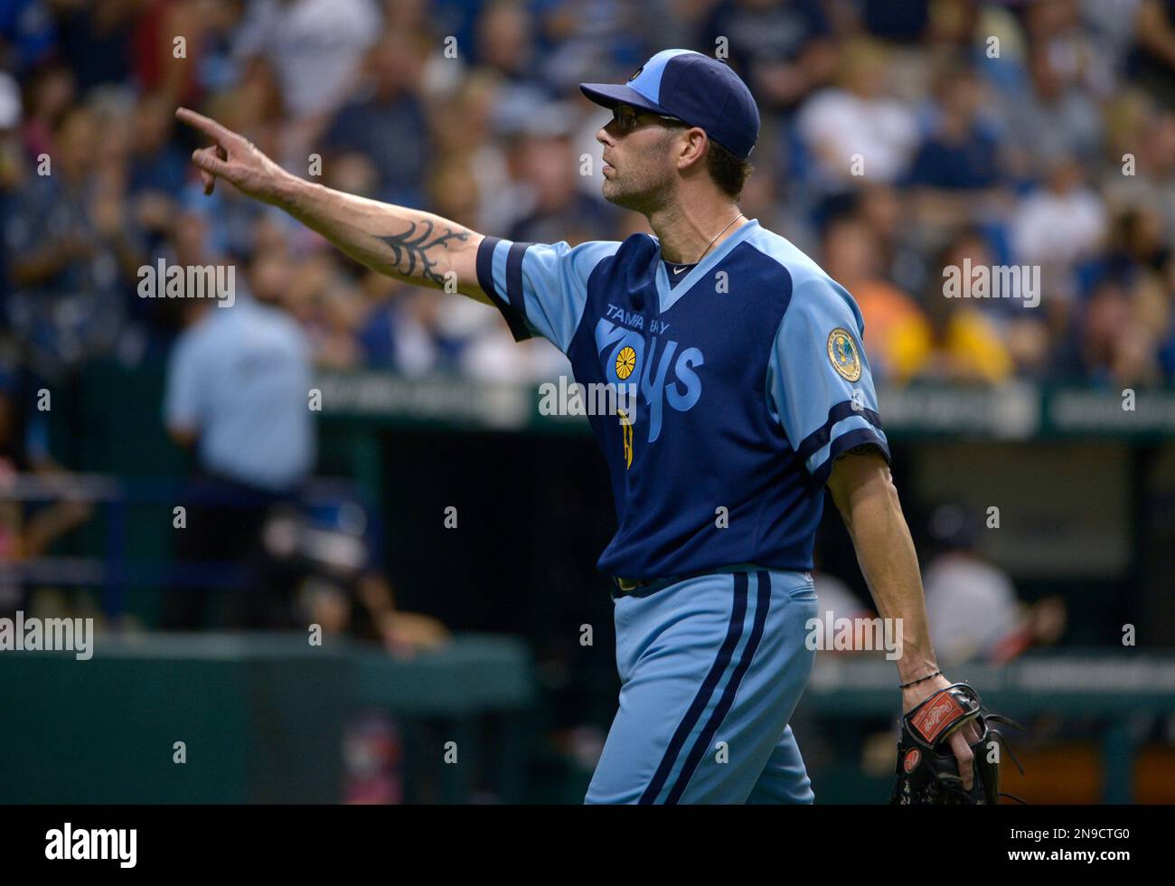 Tampa Bay Rays pitcher Kyle Farnsworth points to the crowd after ...