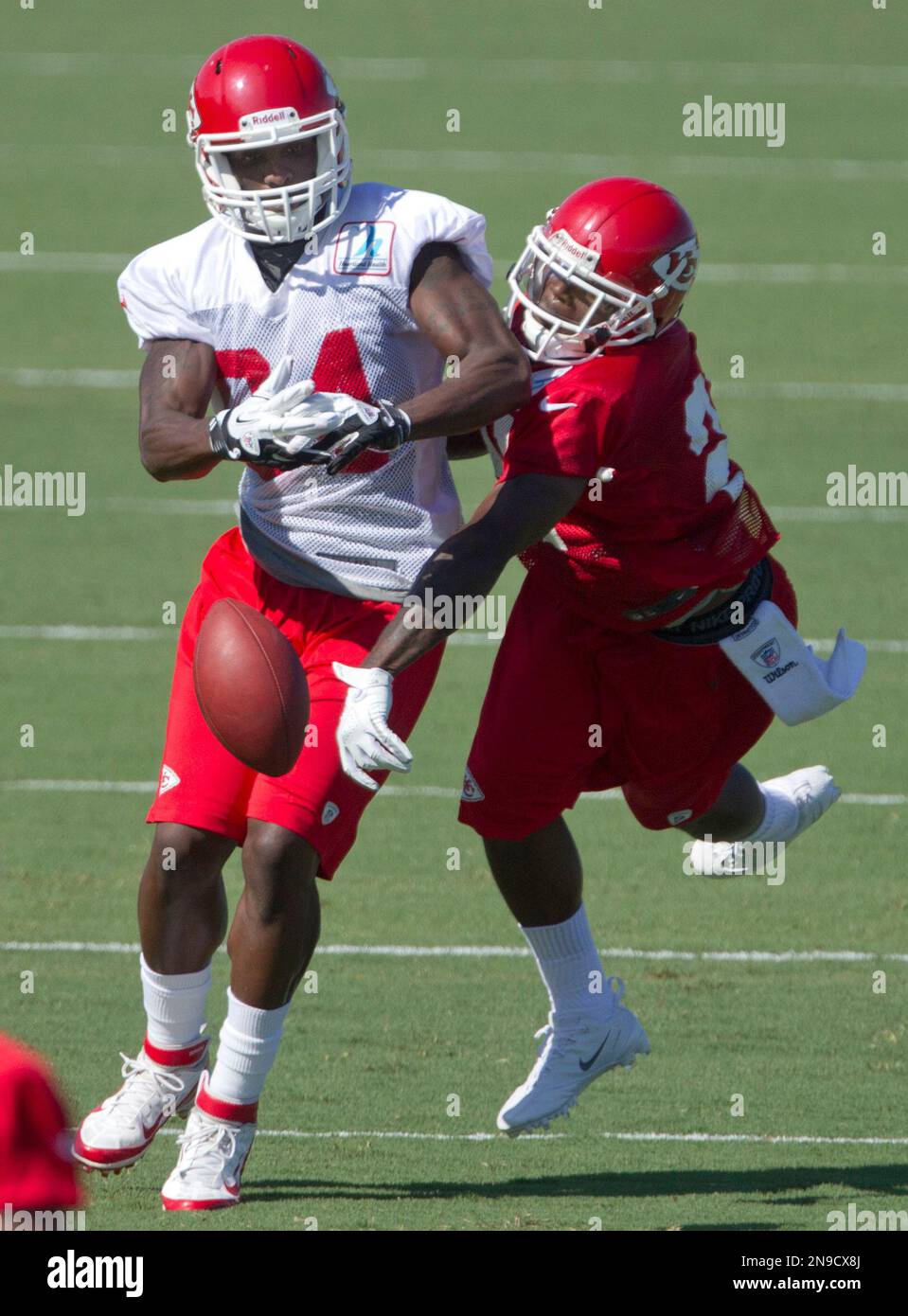 Kansas City Chiefs cornerback Javier Arenas, right, knocks the ball ...