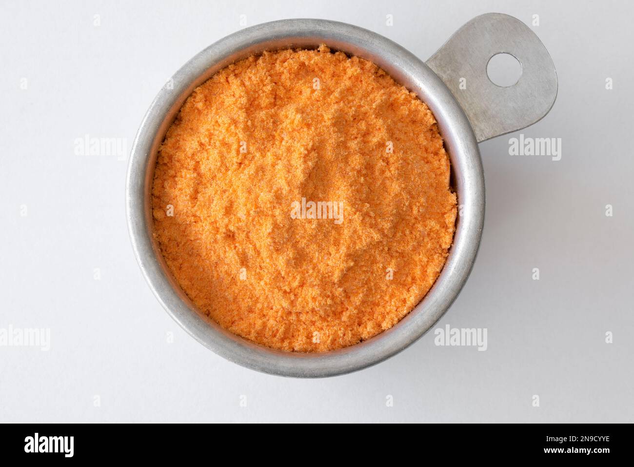 Cheese Powder in a Vintage Measuring Cup Stock Photo - Alamy