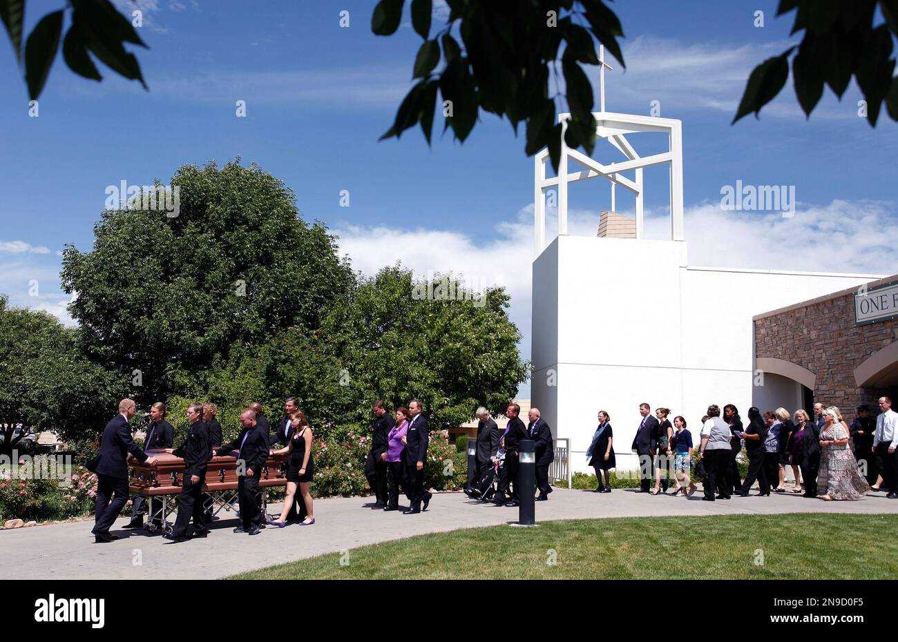 Family and friend follow the caskett of Alexander A. J. Boik from Queen ...