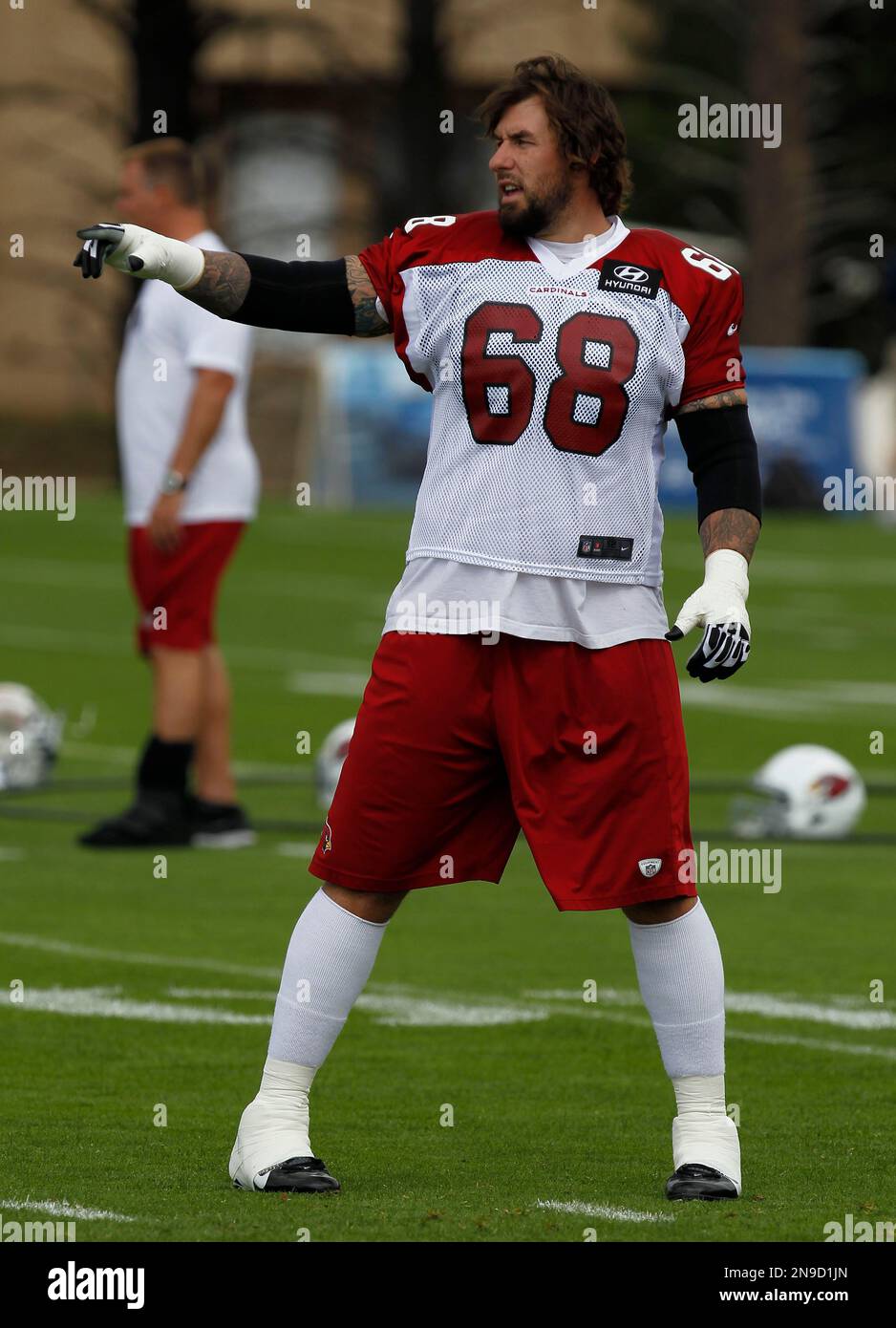 Arizona Cardinals' Adam Snyder (68) motions to other linemen during the ...