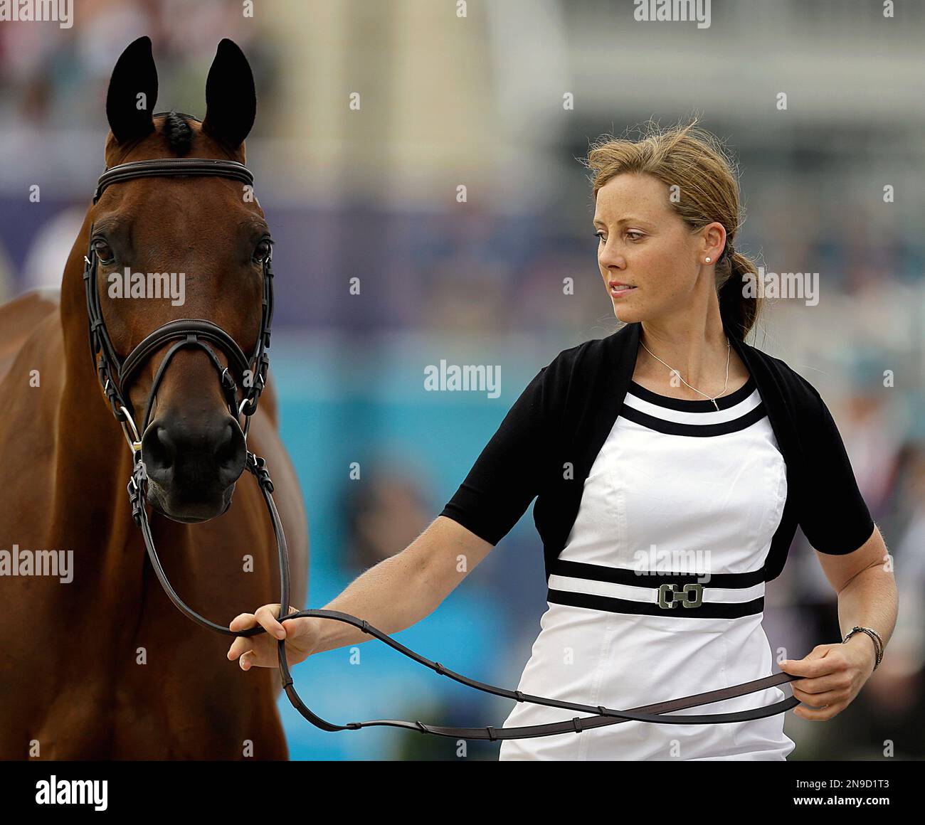 Canada's Rebecca Howard and her horse Riddle Master run during a horse ...