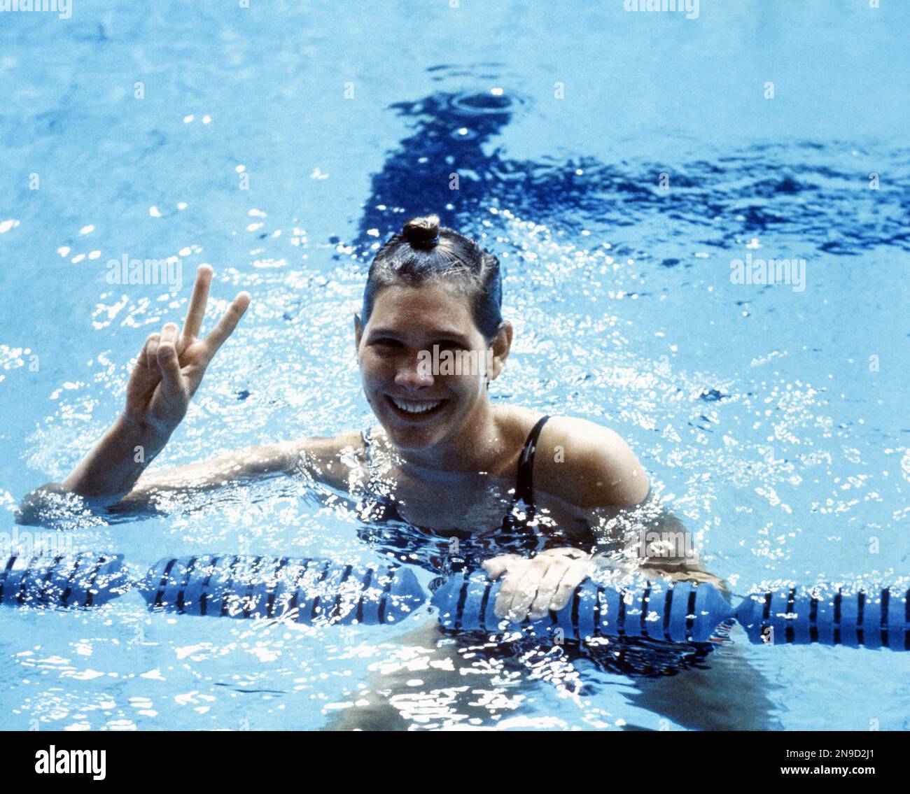 US swimmer Melissa Belote flashes a victory sign after winning the gold ...