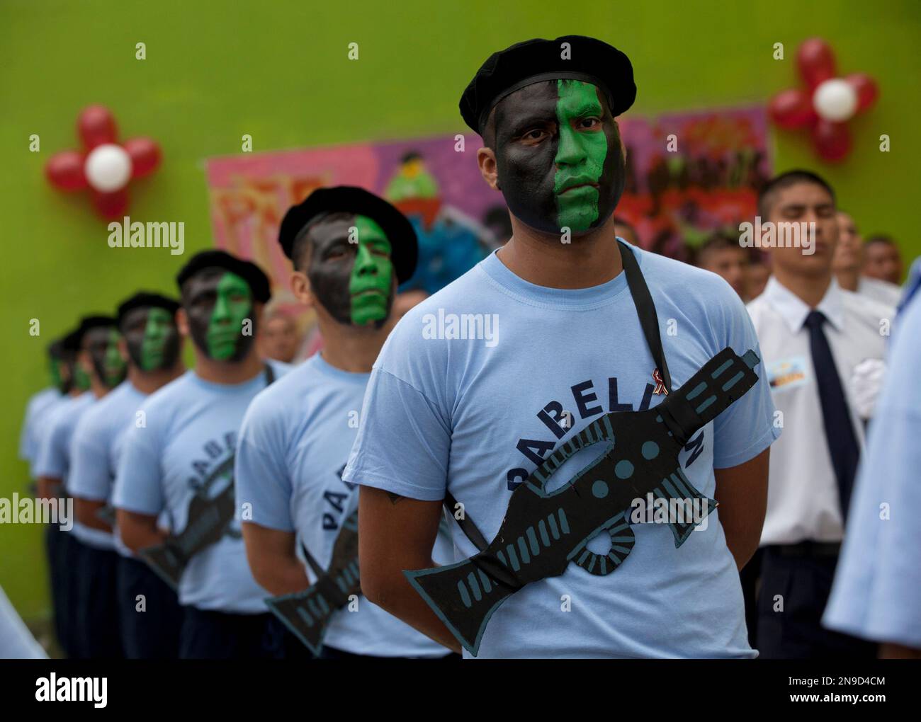 Inmates dressed as soldiers line up to participate in a parade marking ...