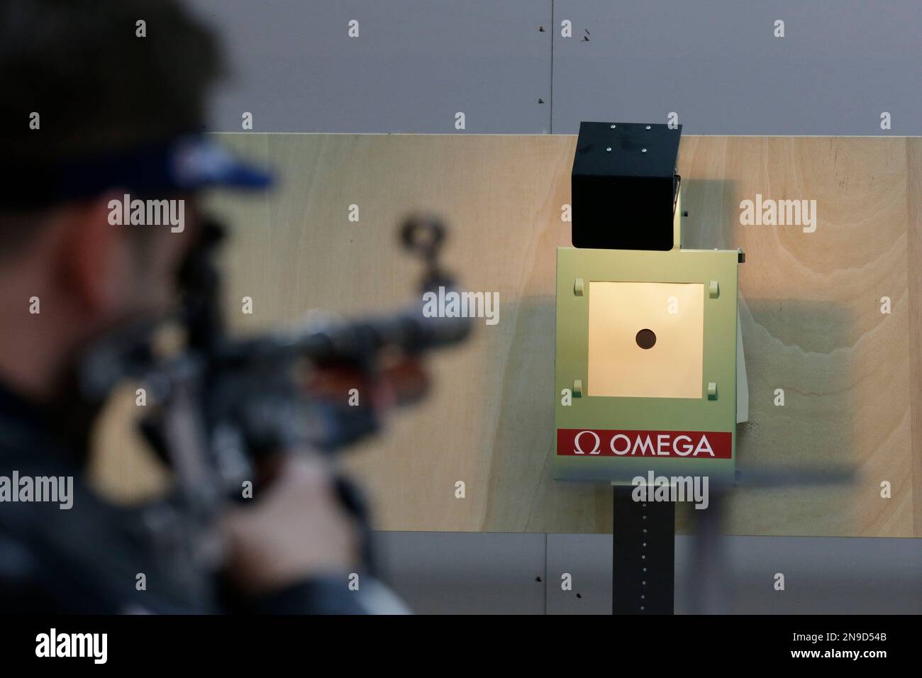An Olympic shooting athlete trains for the 10-meter air rifle event, at ...