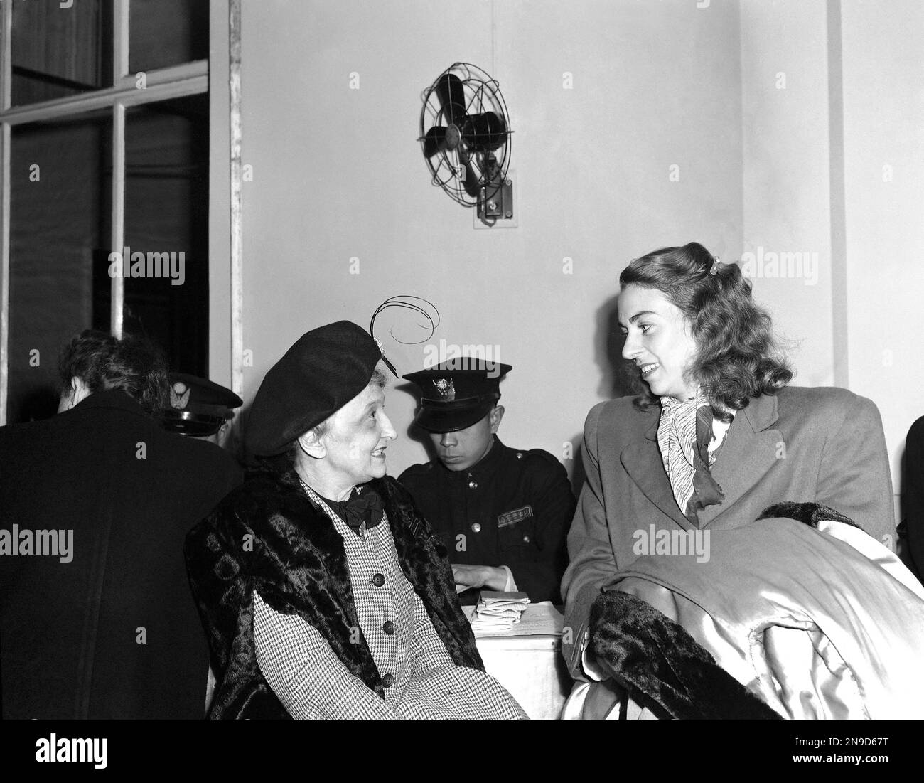 Mrs. Hazel Moore, left, arrives at the Lunghwa Airfiled, Shanghai ...