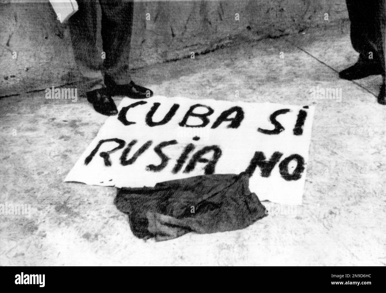 Hand printed placard and part of a red cloth resembling the Russian ...