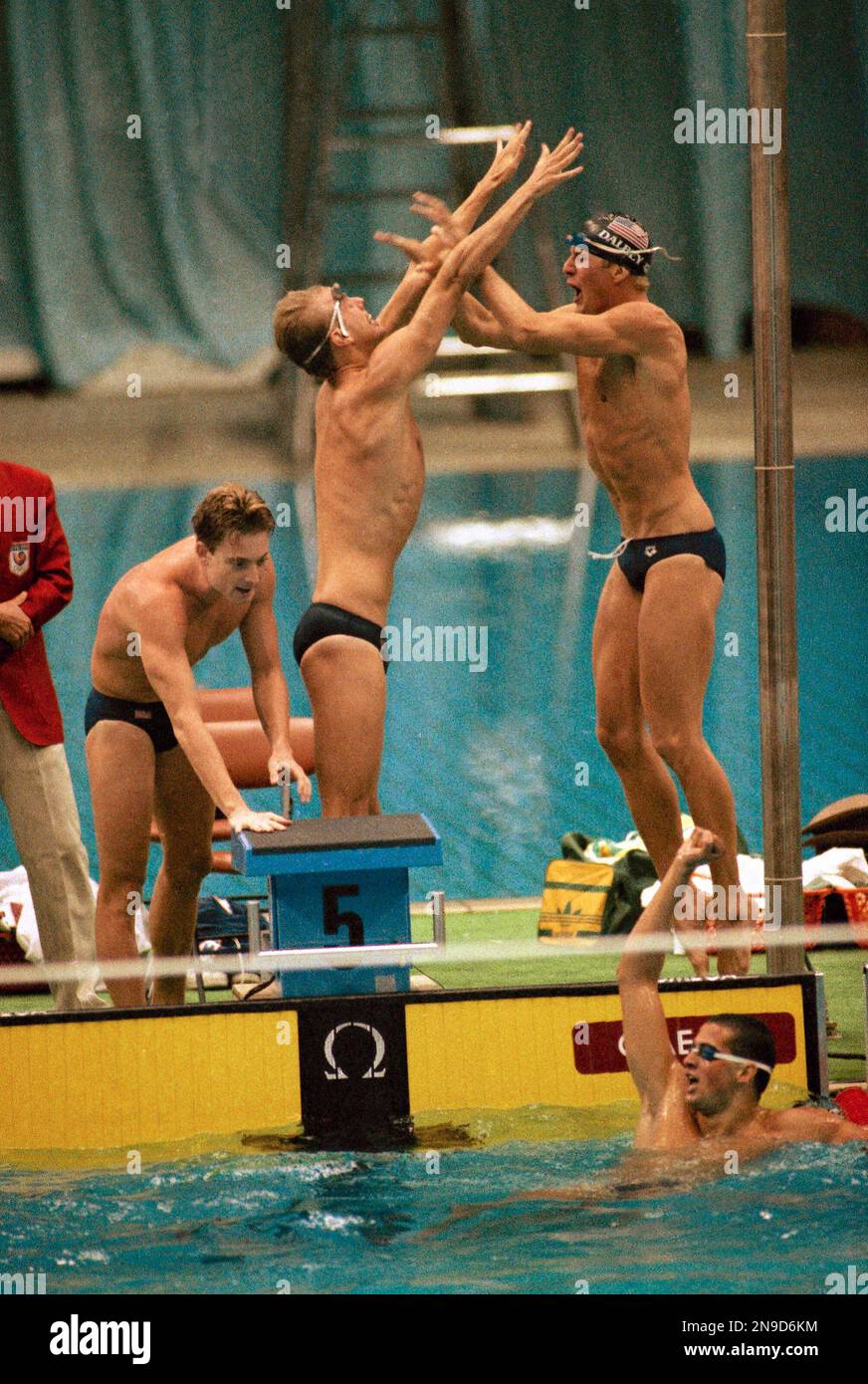 The U.S. Men's 4x200-meter freestyle relay team, including Matt Biondi in the water and Troy ...