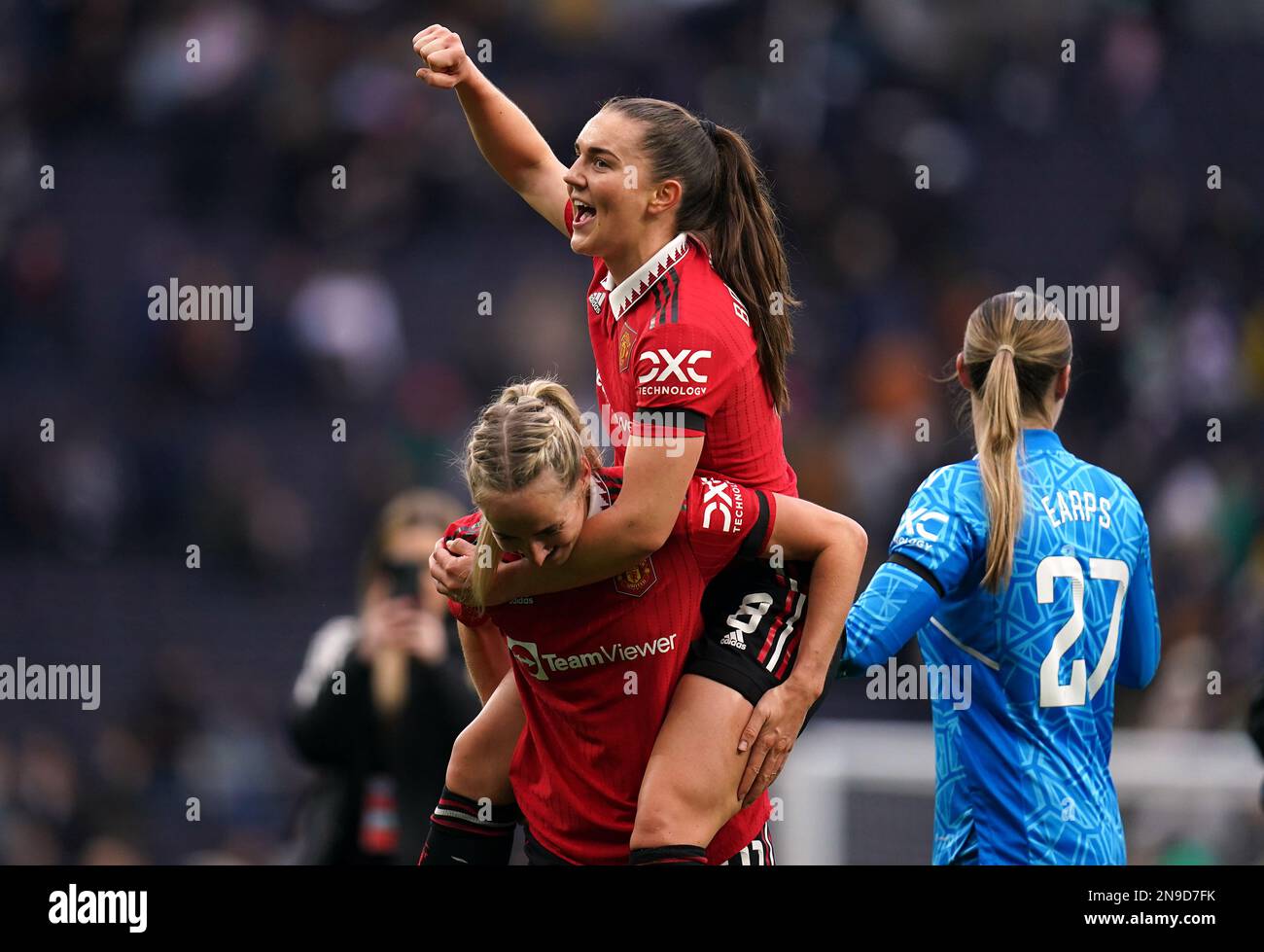 Manchester United's Vilde Boe Risa celebrates by jumping on the back of ...