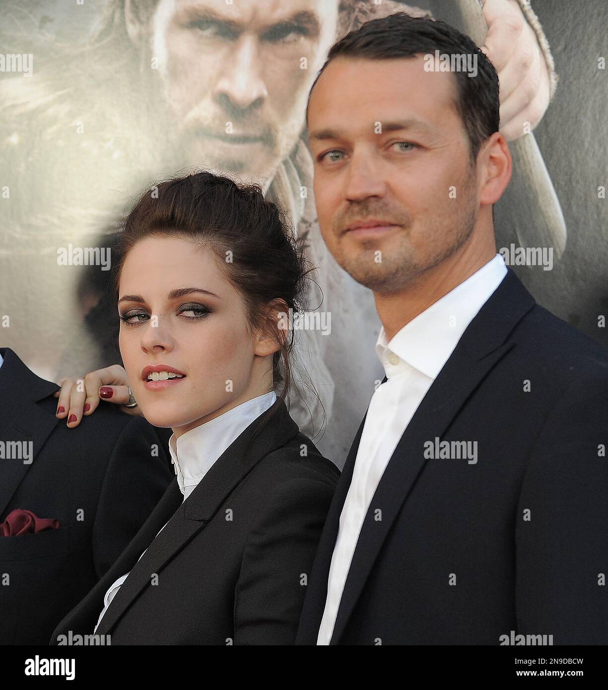 Actress Kristen Stewart and director Rupert Sanders attend the "Snow ...