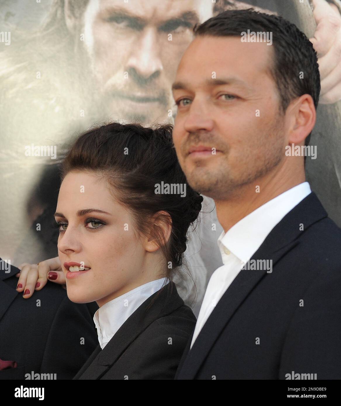 Actress Kristen Stewart and director Rupert Sanders attend the "Snow ...
