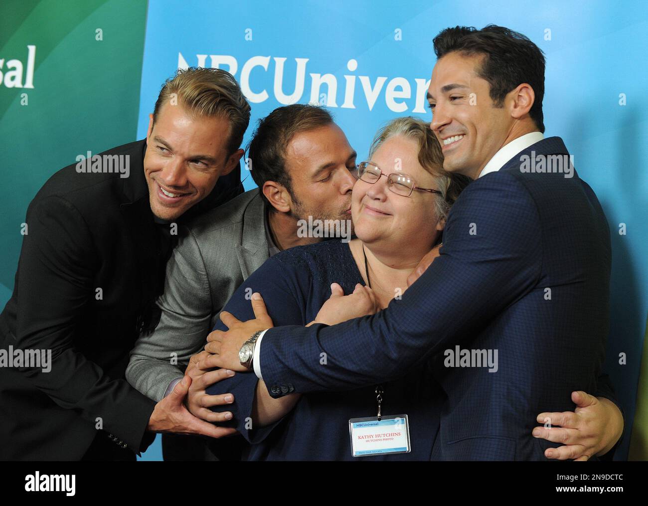 (L-R) Tim Lopez, Ernesto Arguello and Ben Patton pose with a member of ...